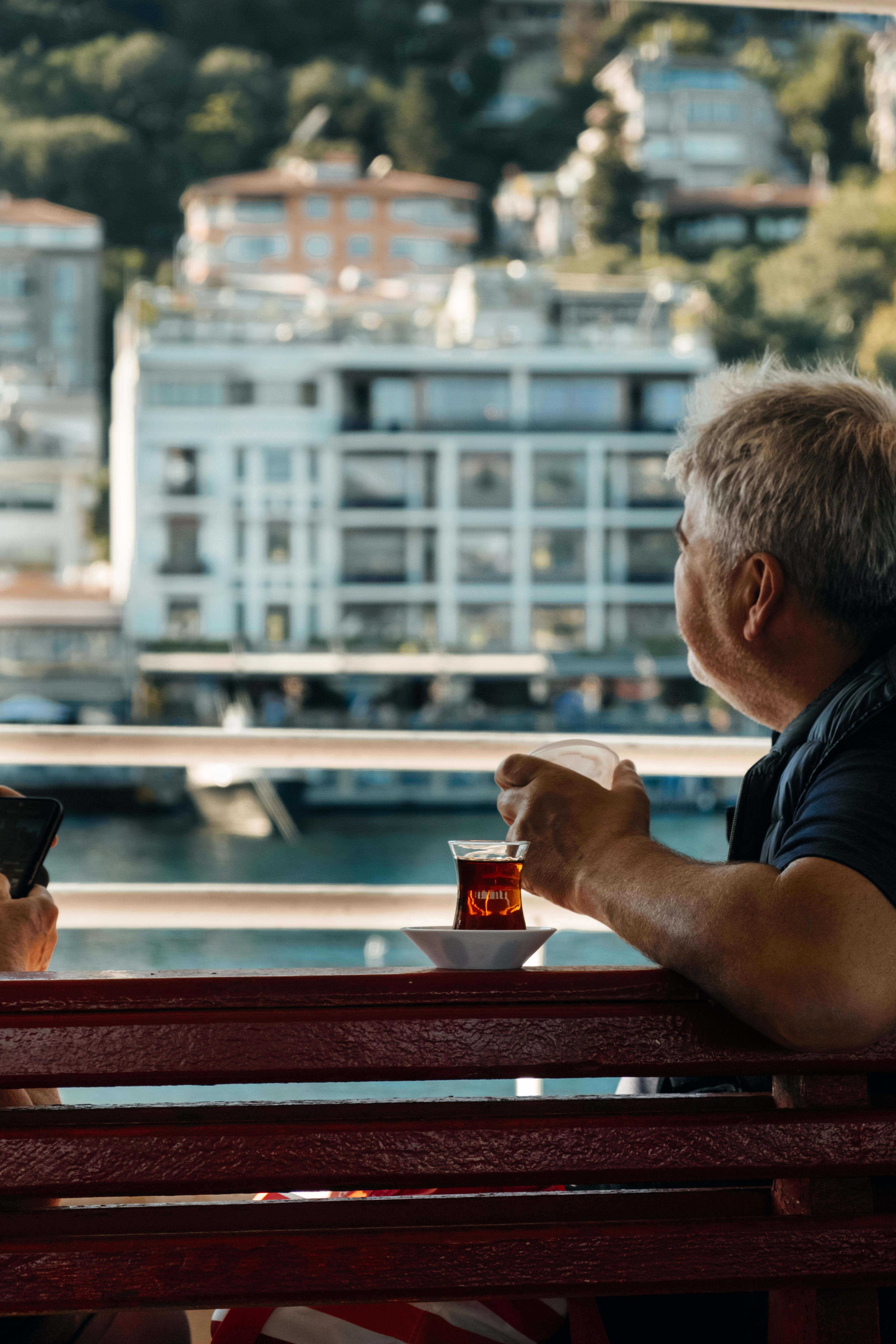 Man Enjoying Turkish Tea with Scenic View · Free Stock Photo