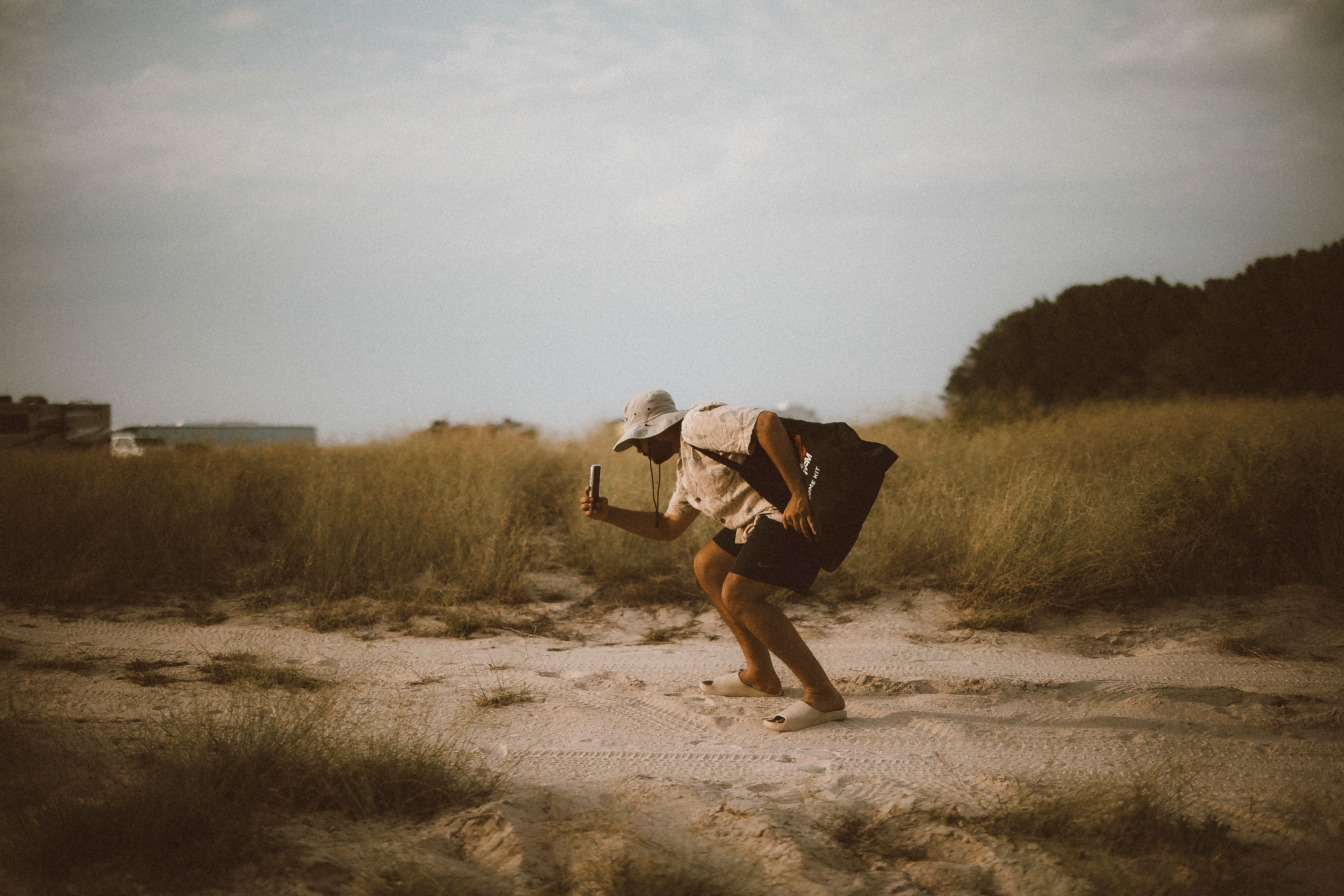 Adventurous Desert Explorer Capturing Moments · Free Stock Photo