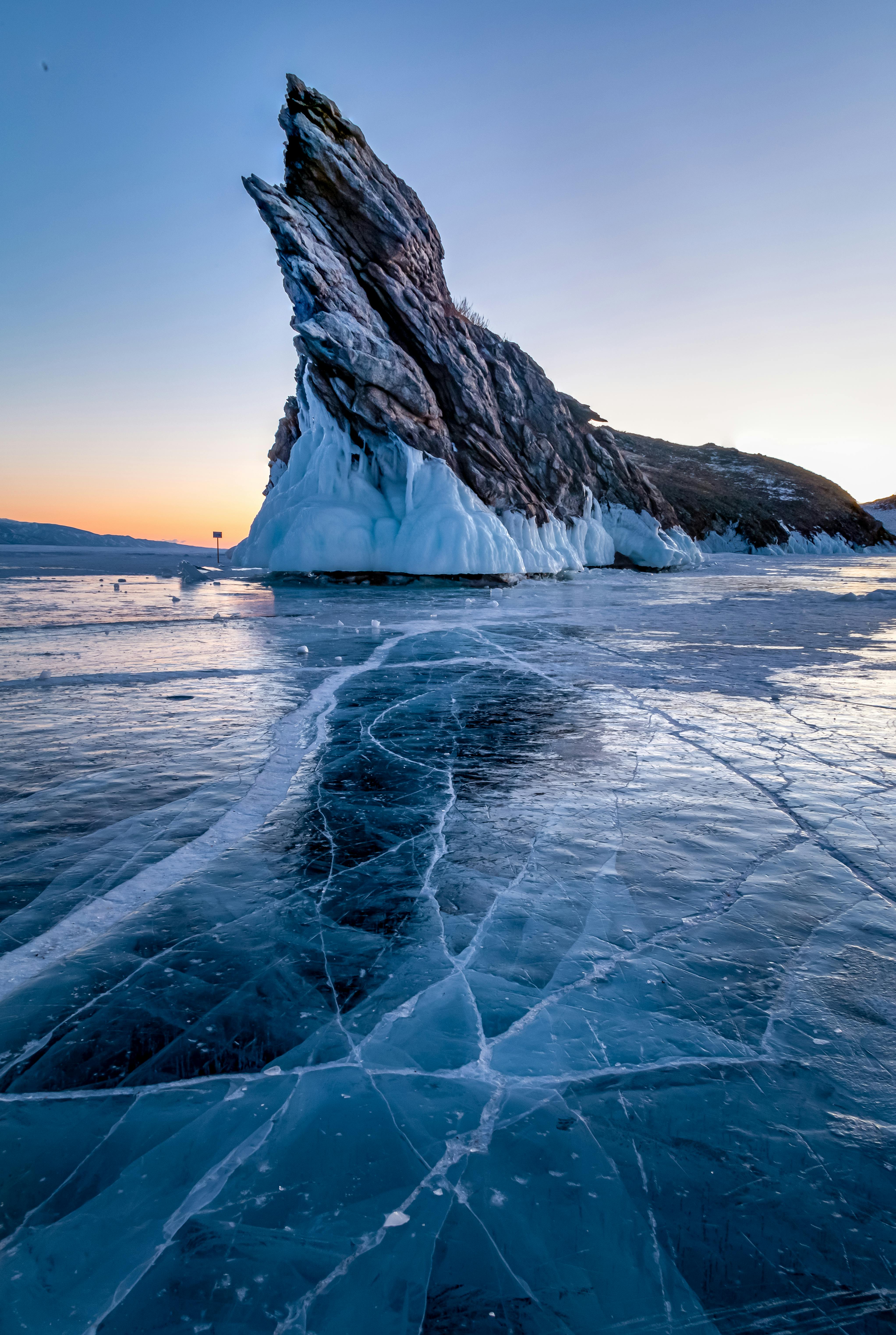 Majestic Ice Formation on Frozen Lake at Sunset · Free Stock Photo