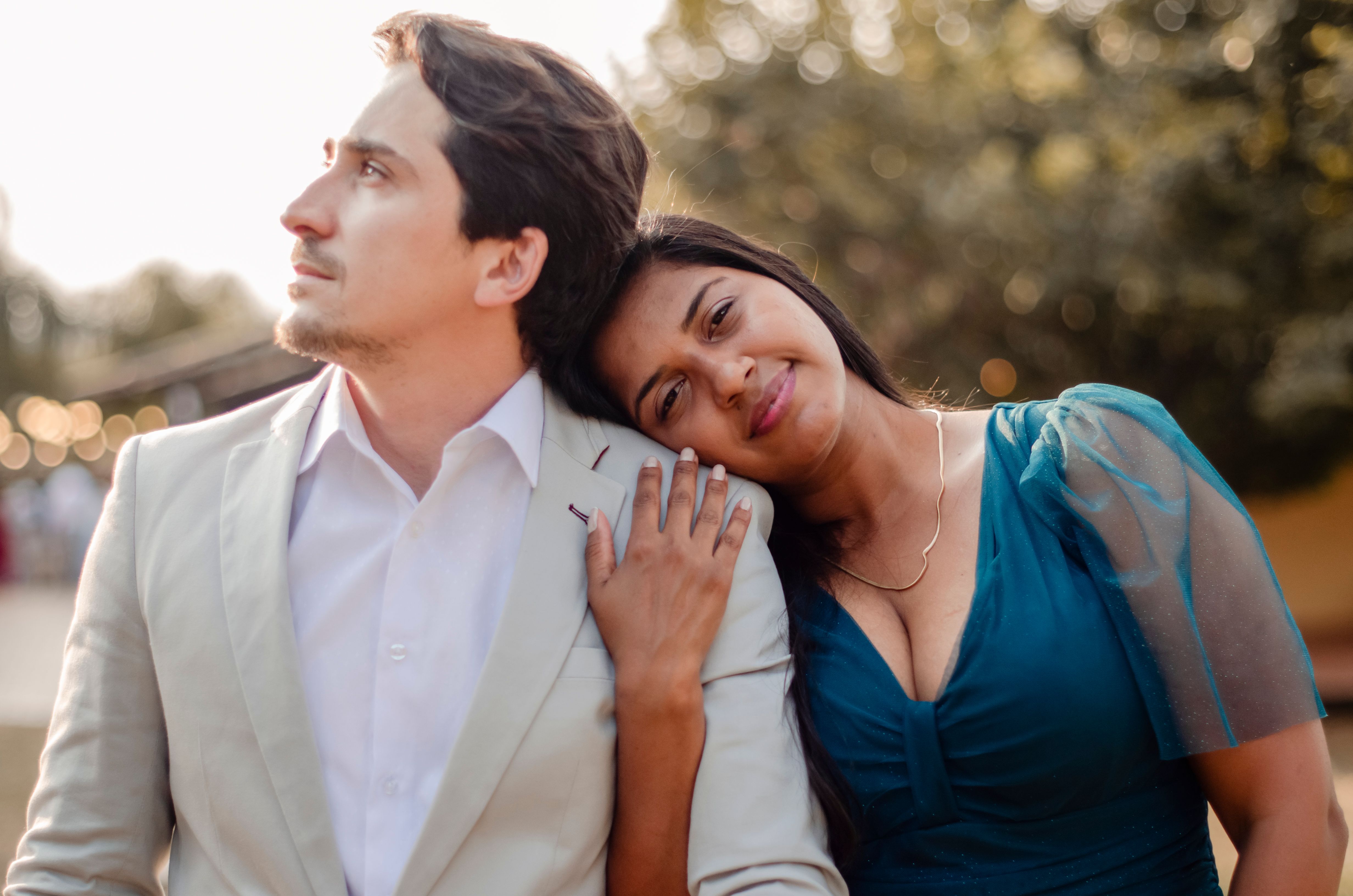 Romantic Couple Embracing Outdoors in Soft Light · Free Stock Photo