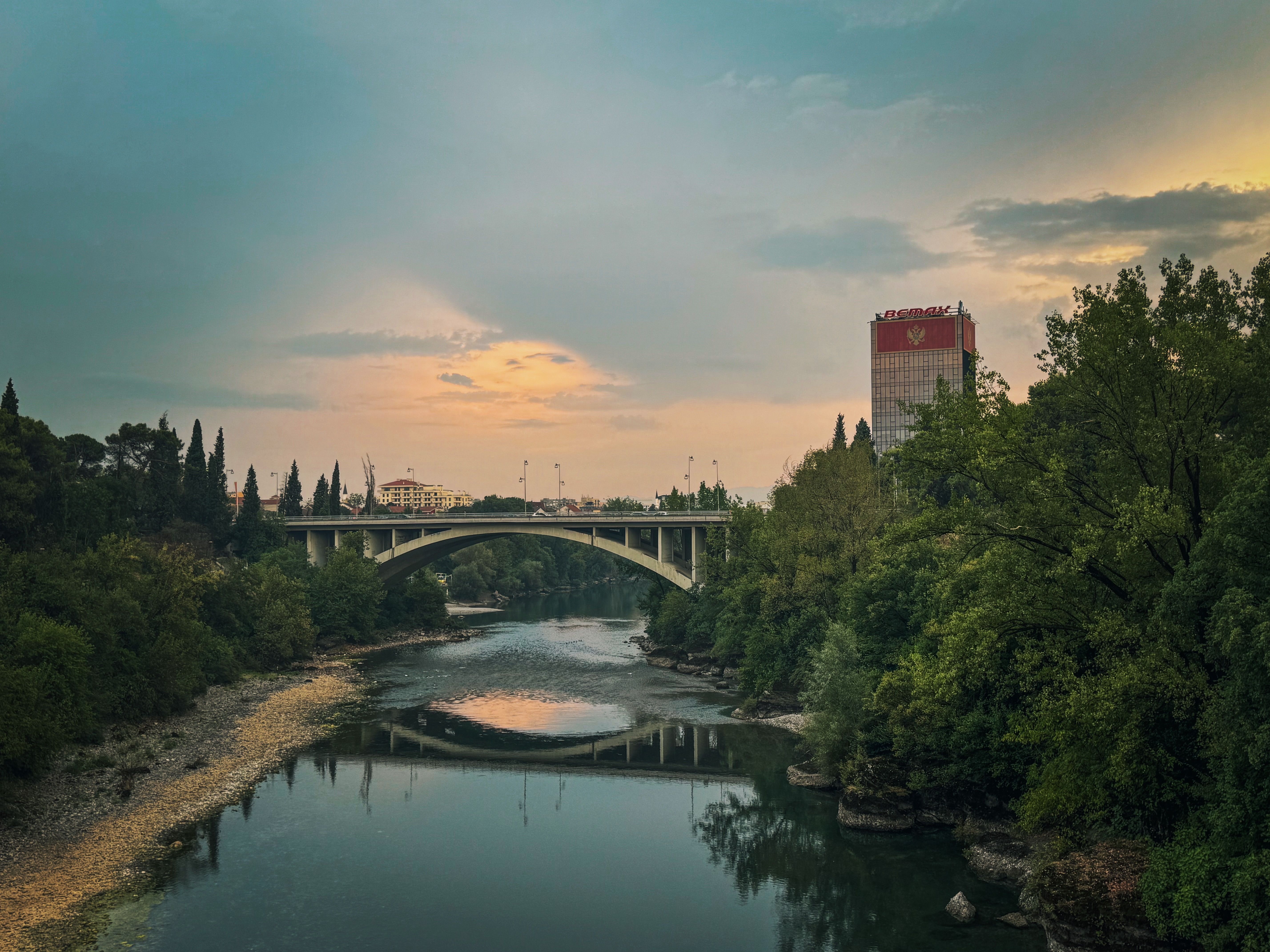 Scenic City River and Bridge at Sunset · Free Stock Photo