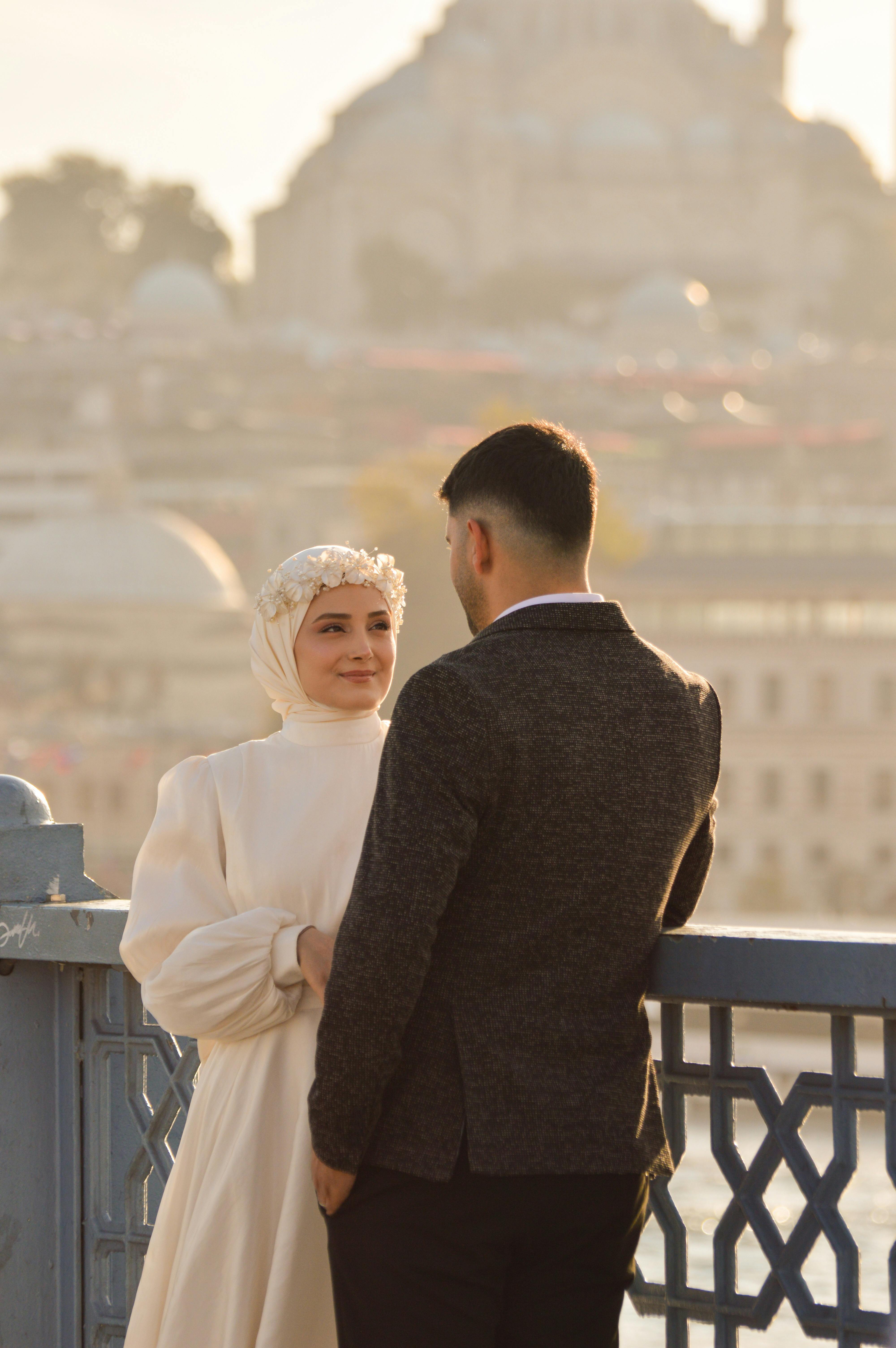 Muslim Couple Looking at City From a Terrace · Free Stock Photo