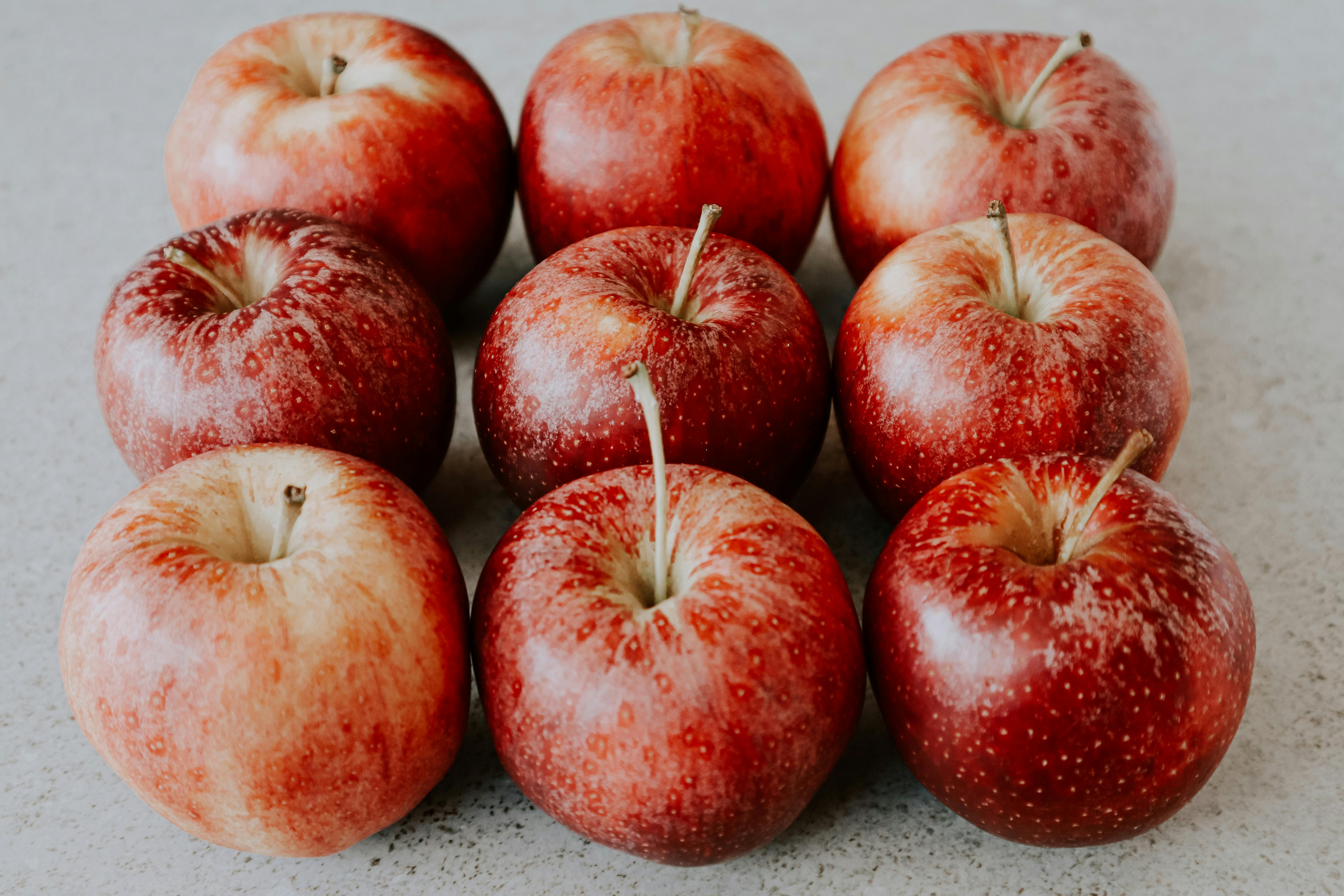 Three Red Apples on Wooden Surface · Free Stock Photo