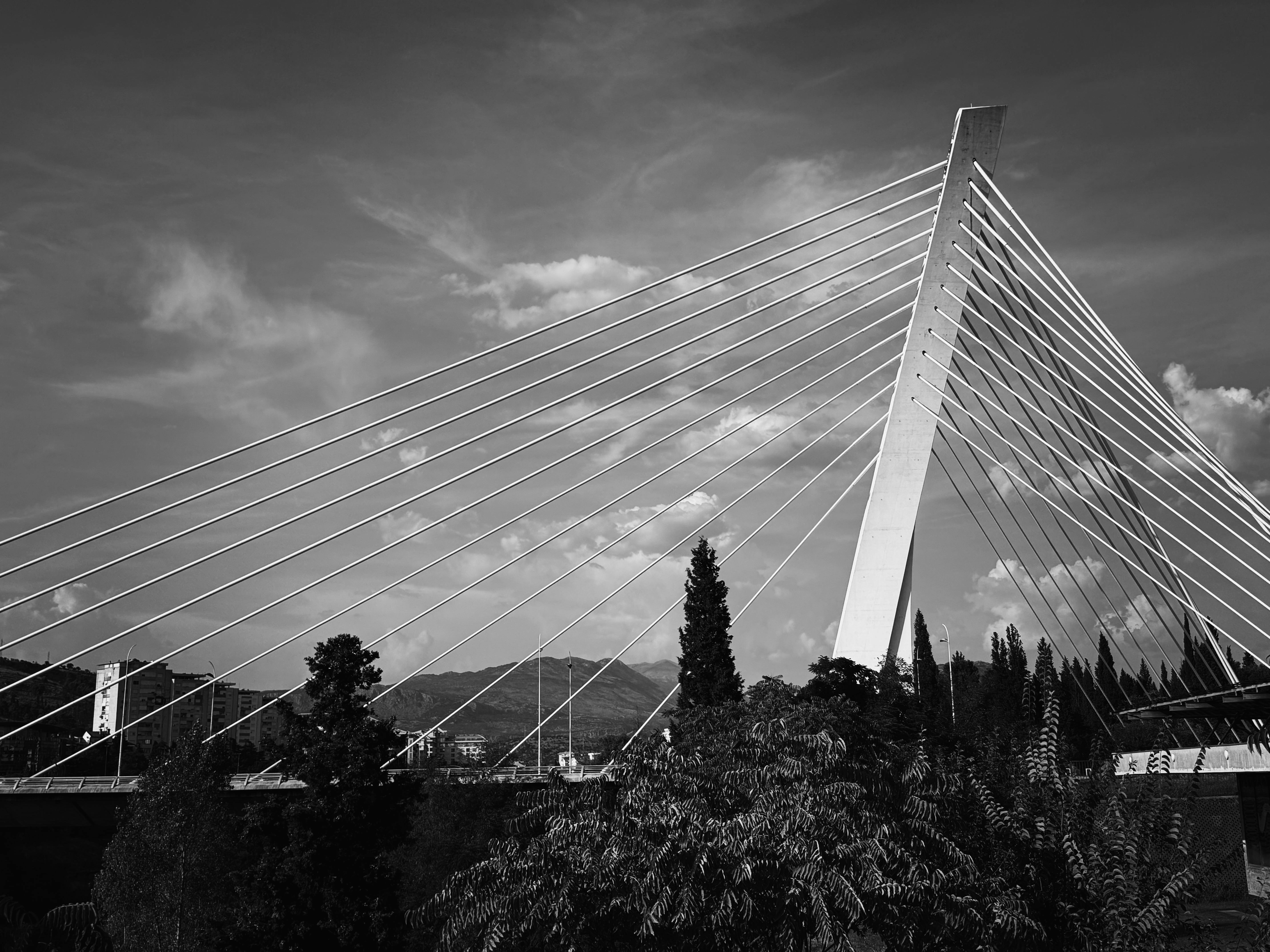 Modern Suspension Bridge Against Dramatic Sky · Free Stock Photo