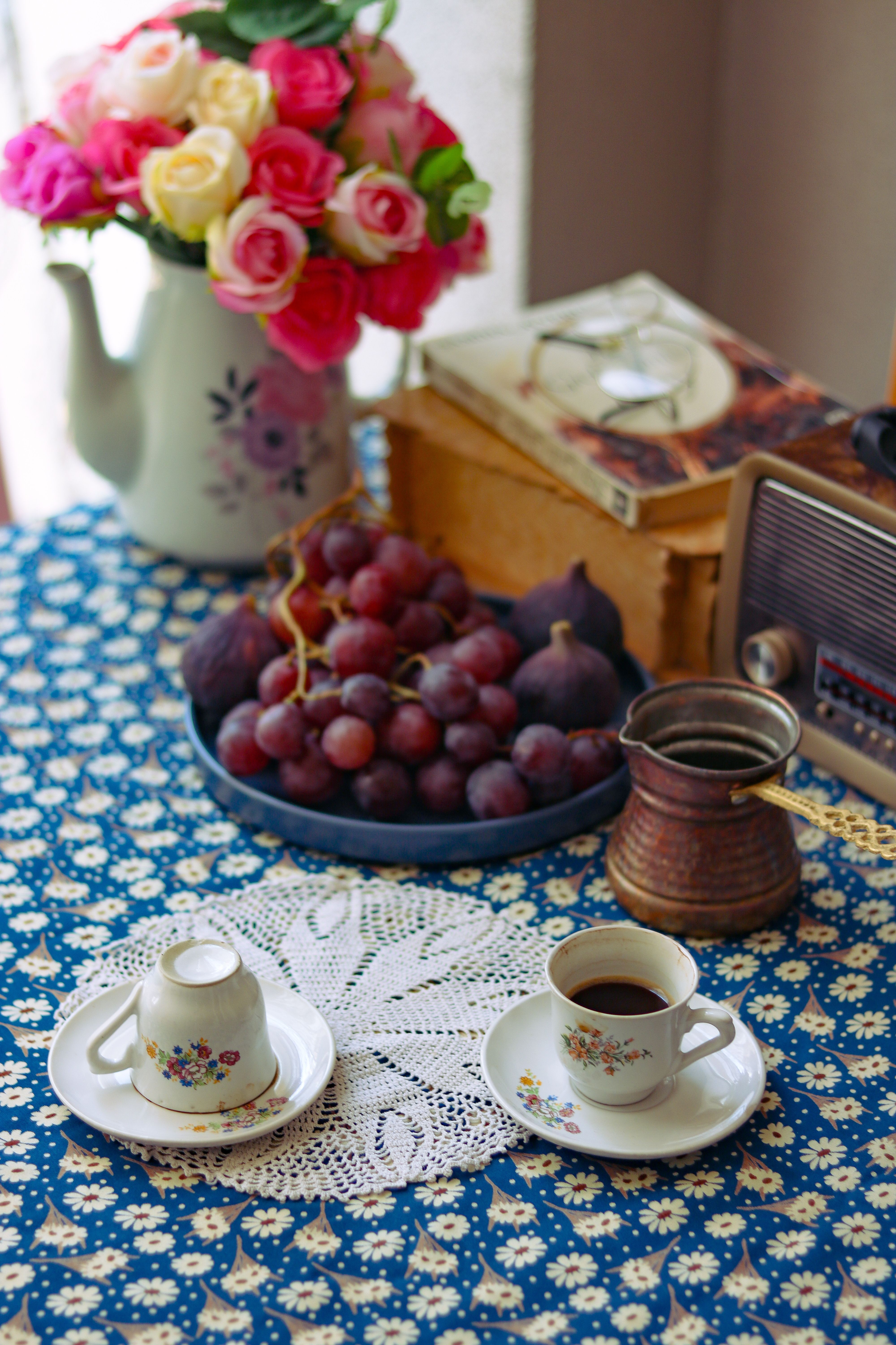 Vintage Tea Setup with Grapes and Radio on Table · Free Stock Photo