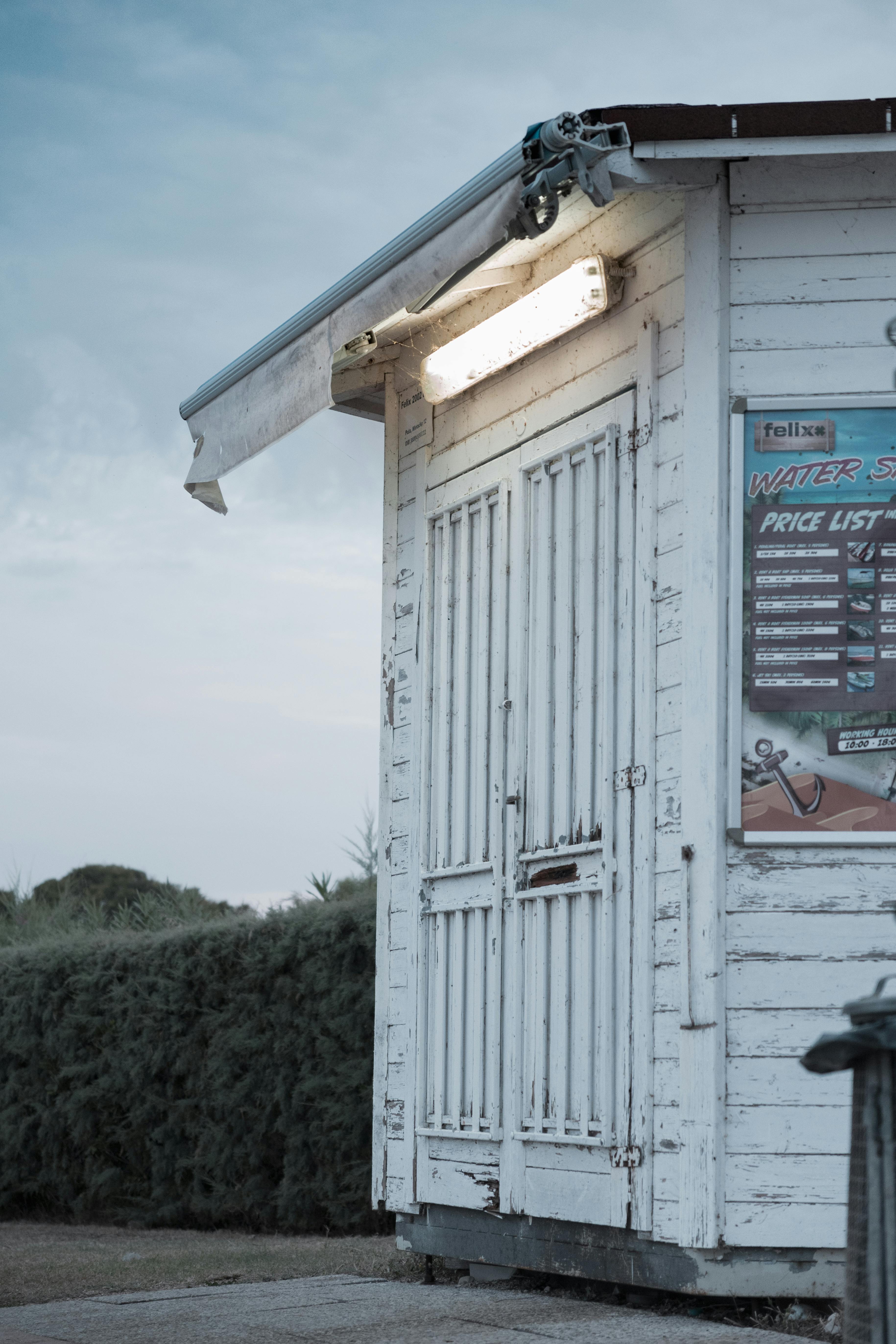 Rustic White Beach Shack at Dusk · Free Stock Photo
