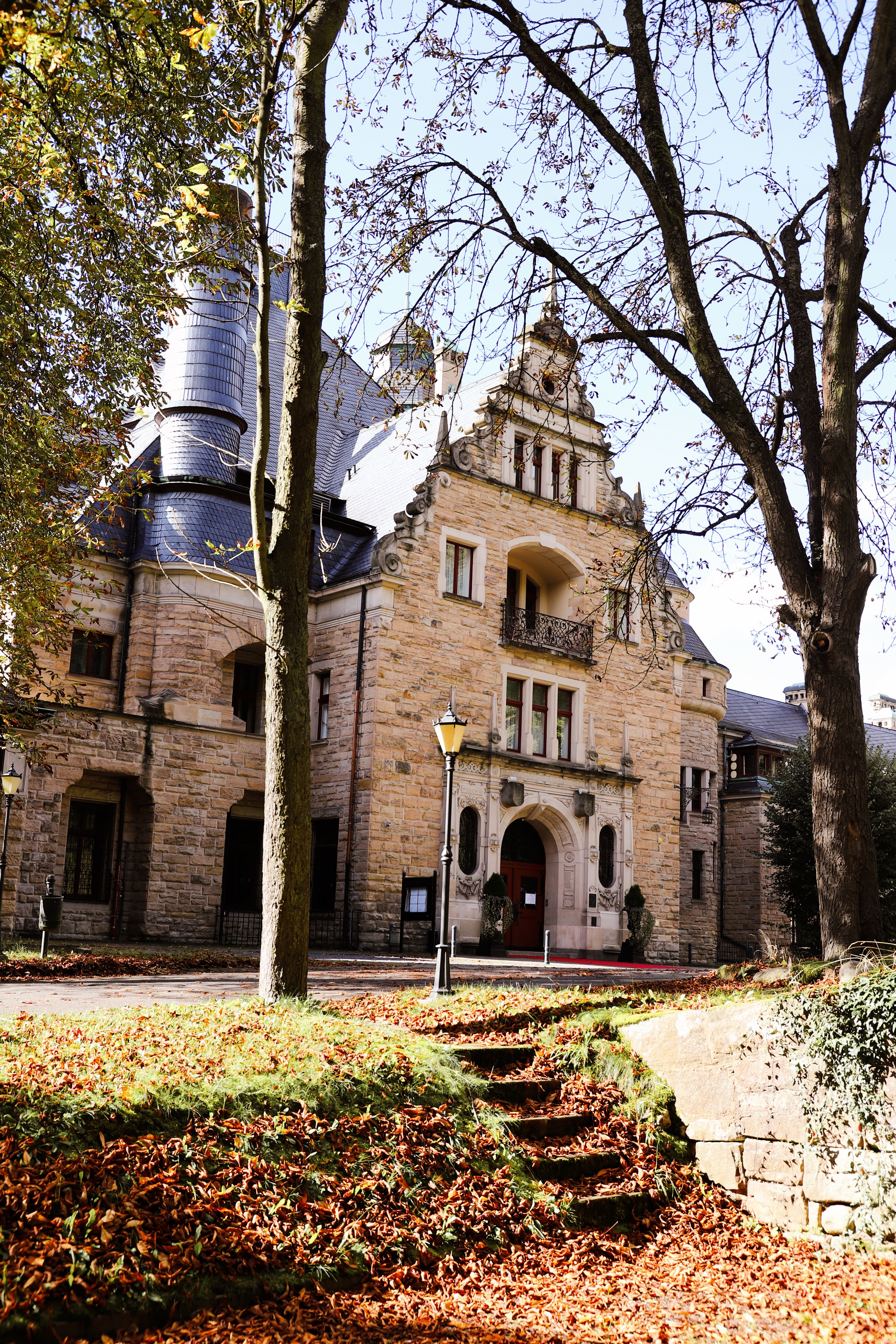 Historic German Castle in Autumn Setting · Free Stock Photo