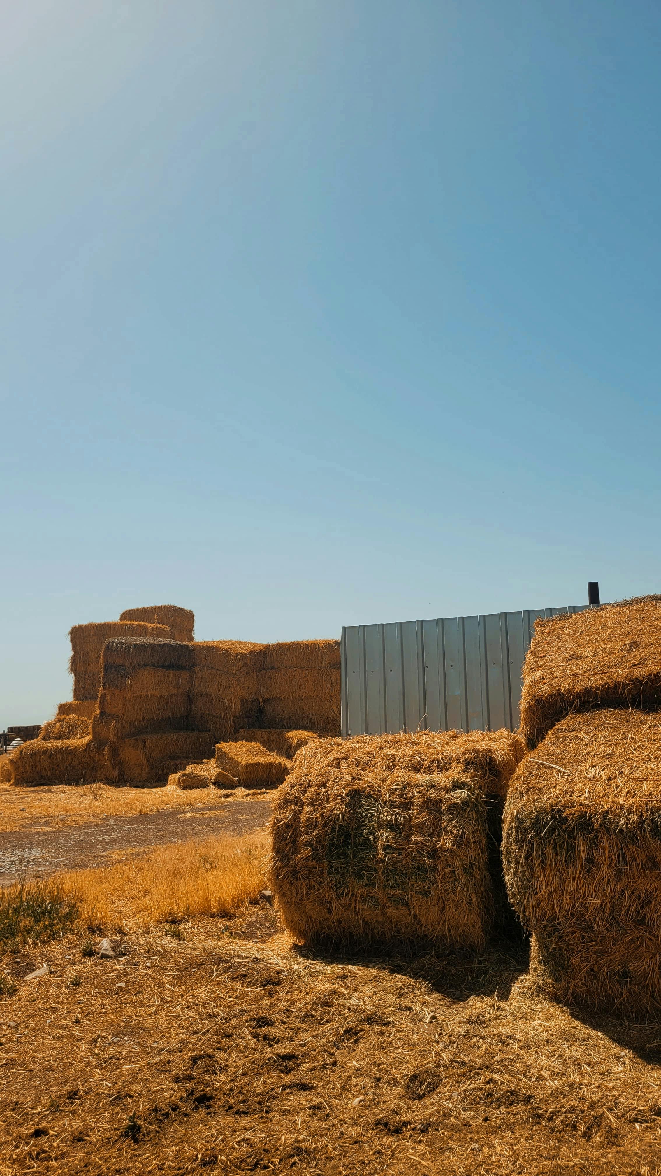Stacked Hay Bales in a Rustic Barn Interior · Free Stock Photo