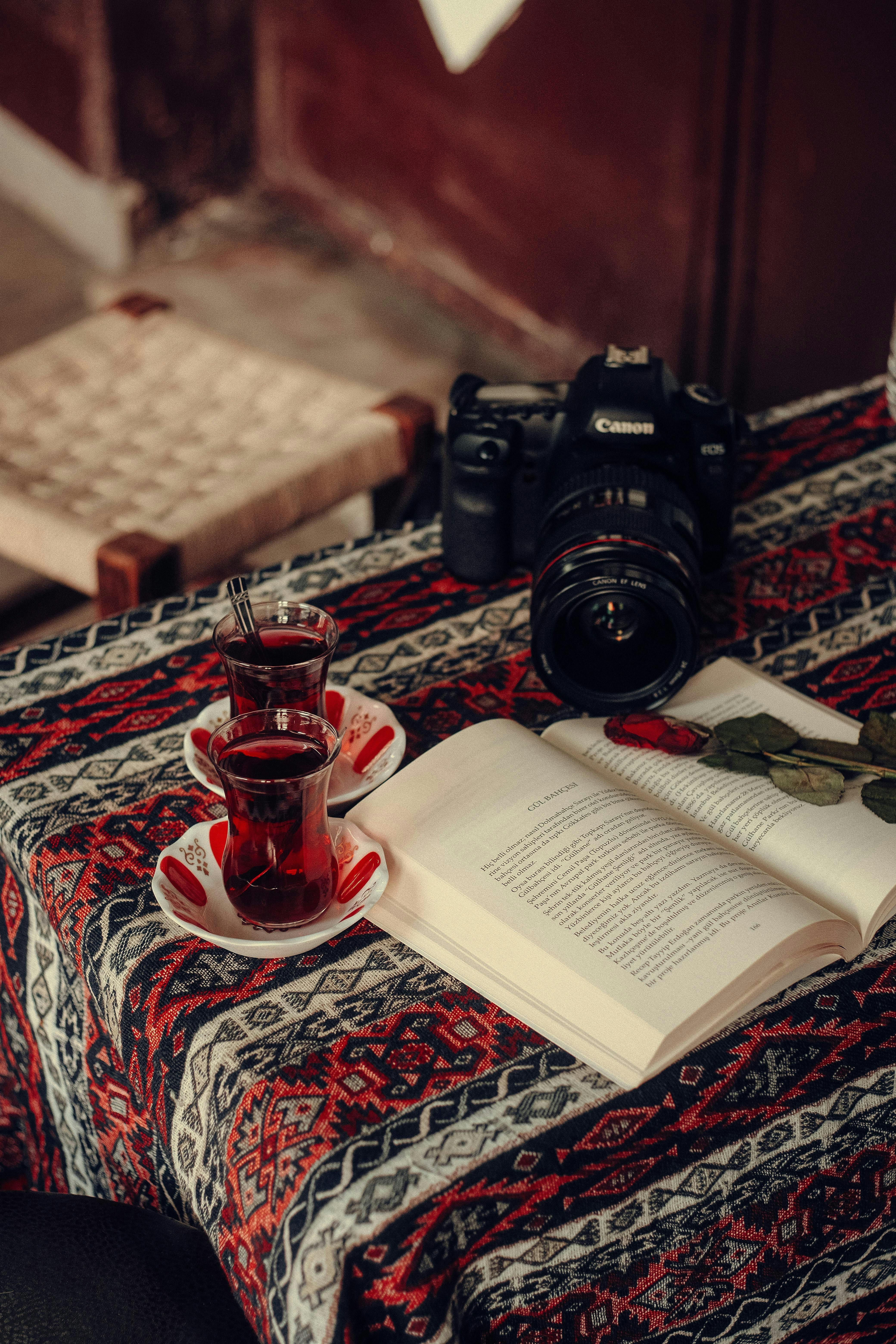 Artistic Setup with Tea, Camera, and Book · Free Stock Photo