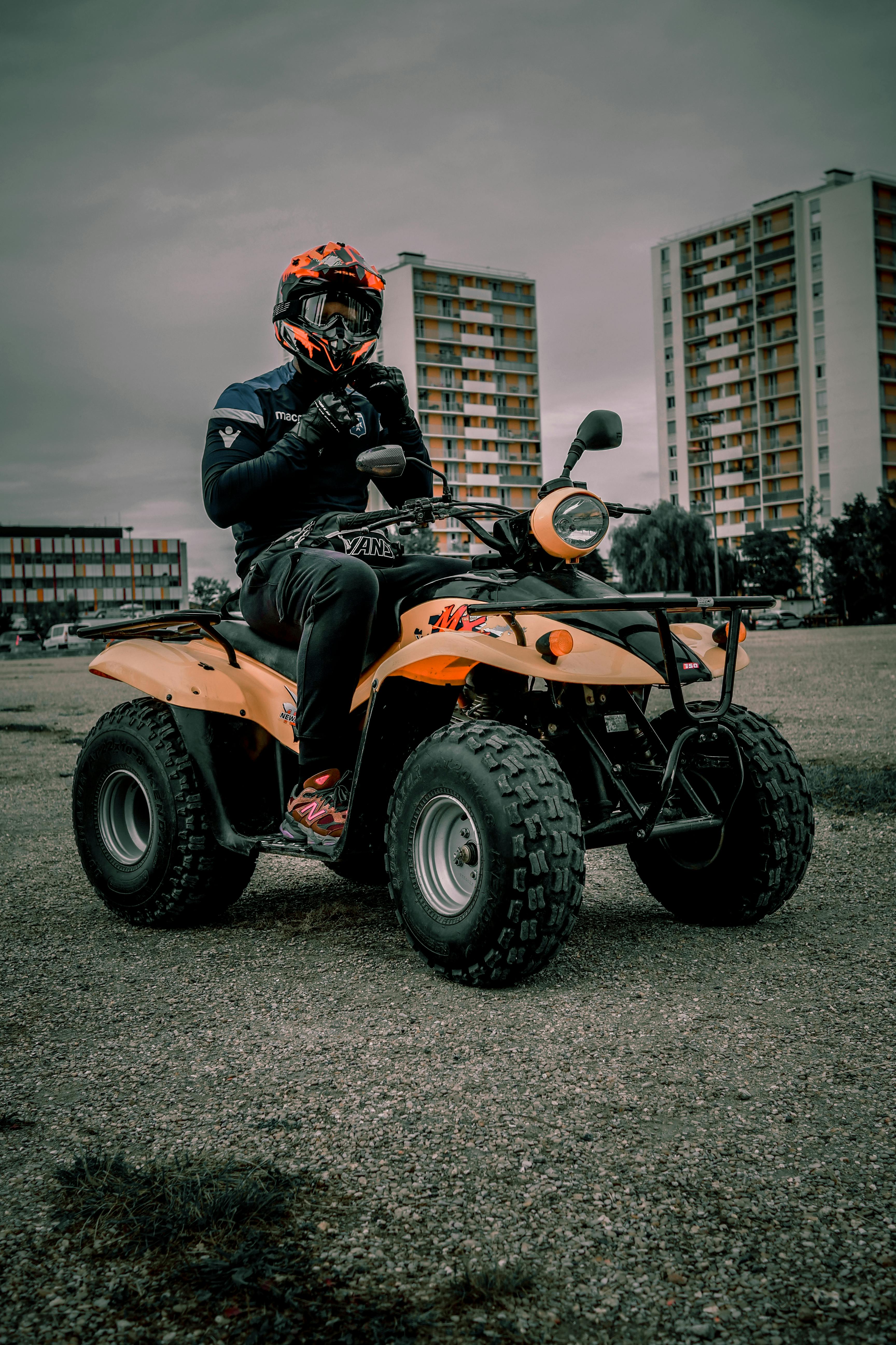 Man Riding Quad Bike in Urban Setting · Free Stock Photo