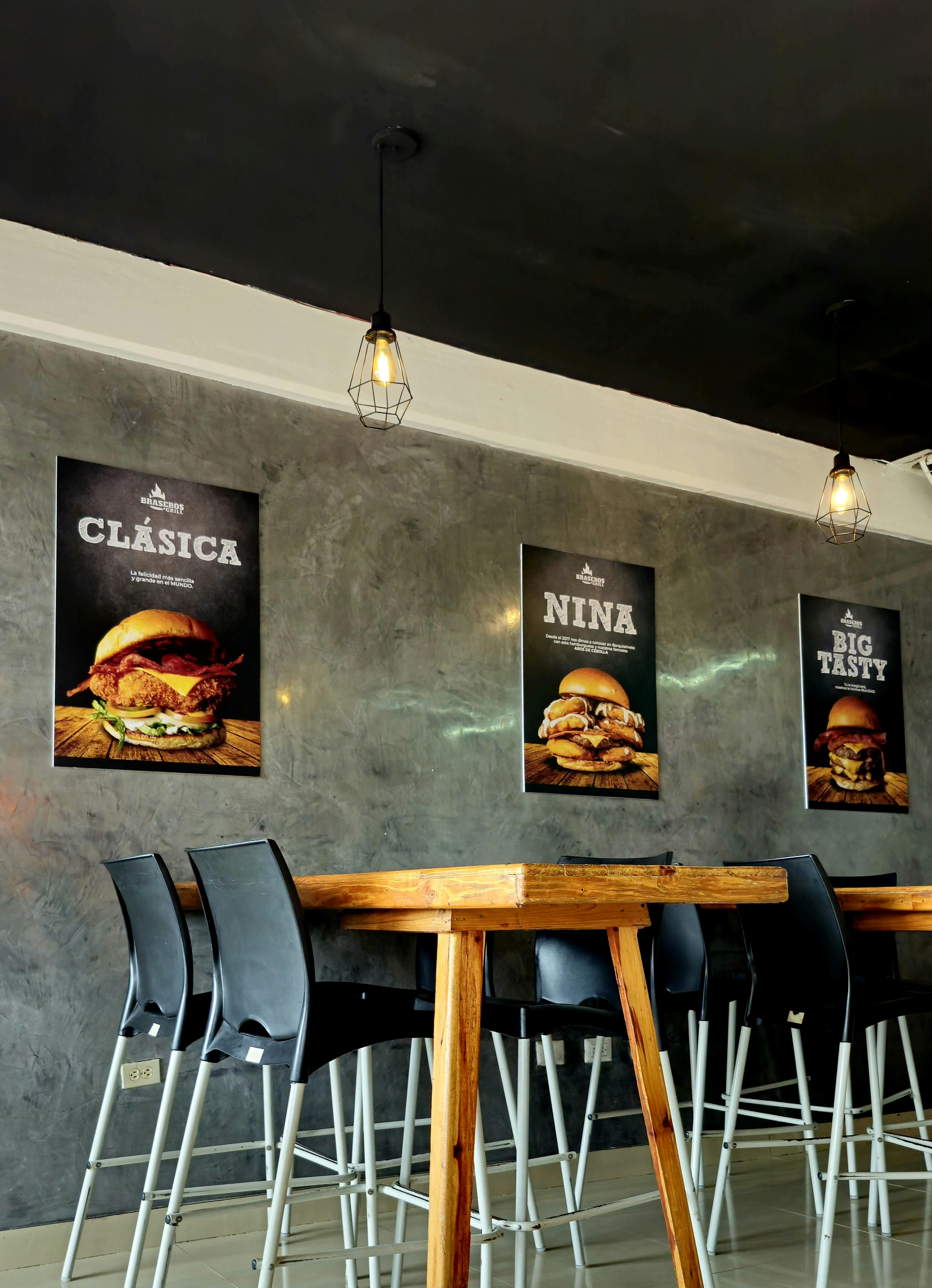 Modern Burger Restaurant Interior with Posters · Free Stock Photo
