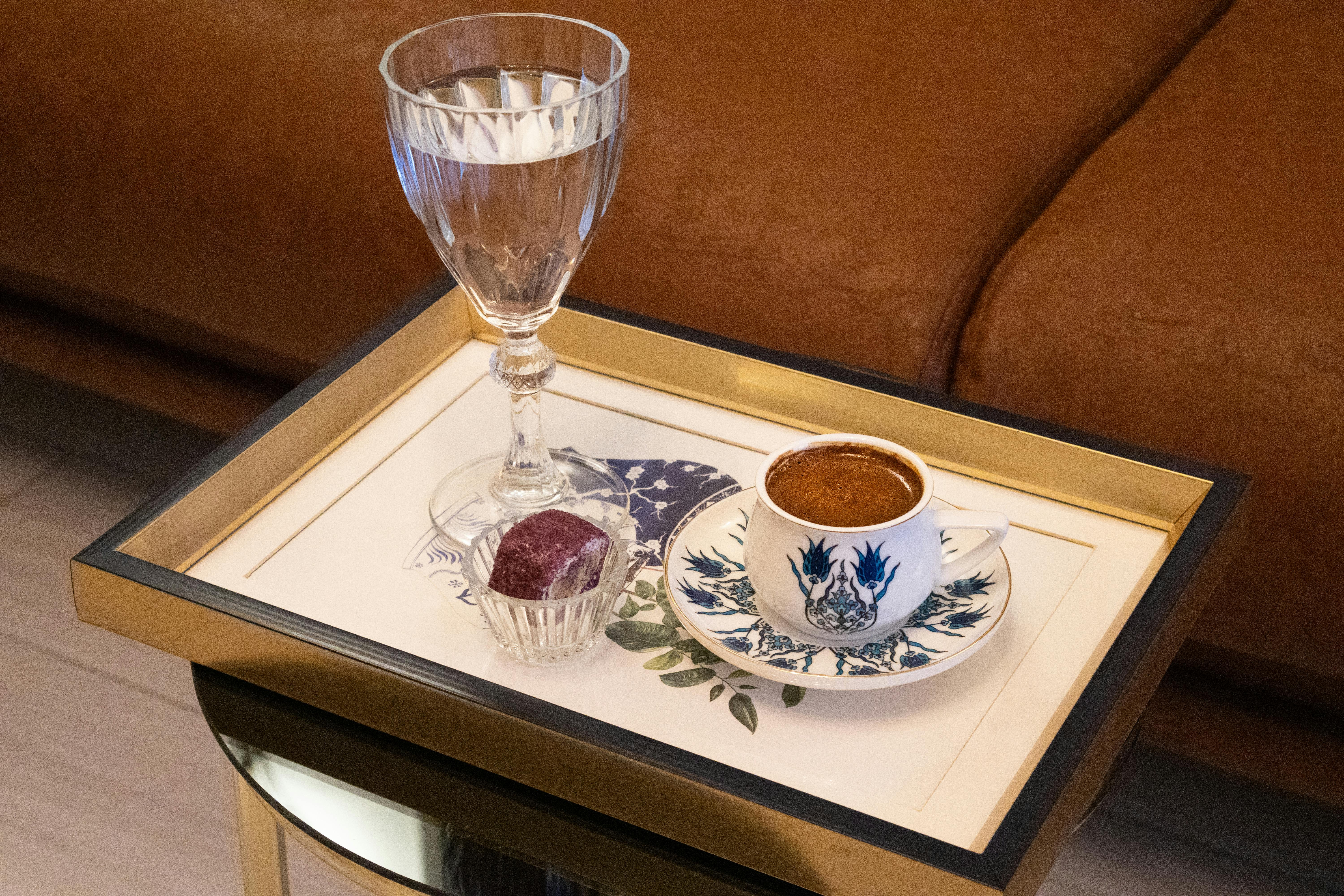 Elegant Coffee Setup with Water and Turkish Delight · Free Stock Photo