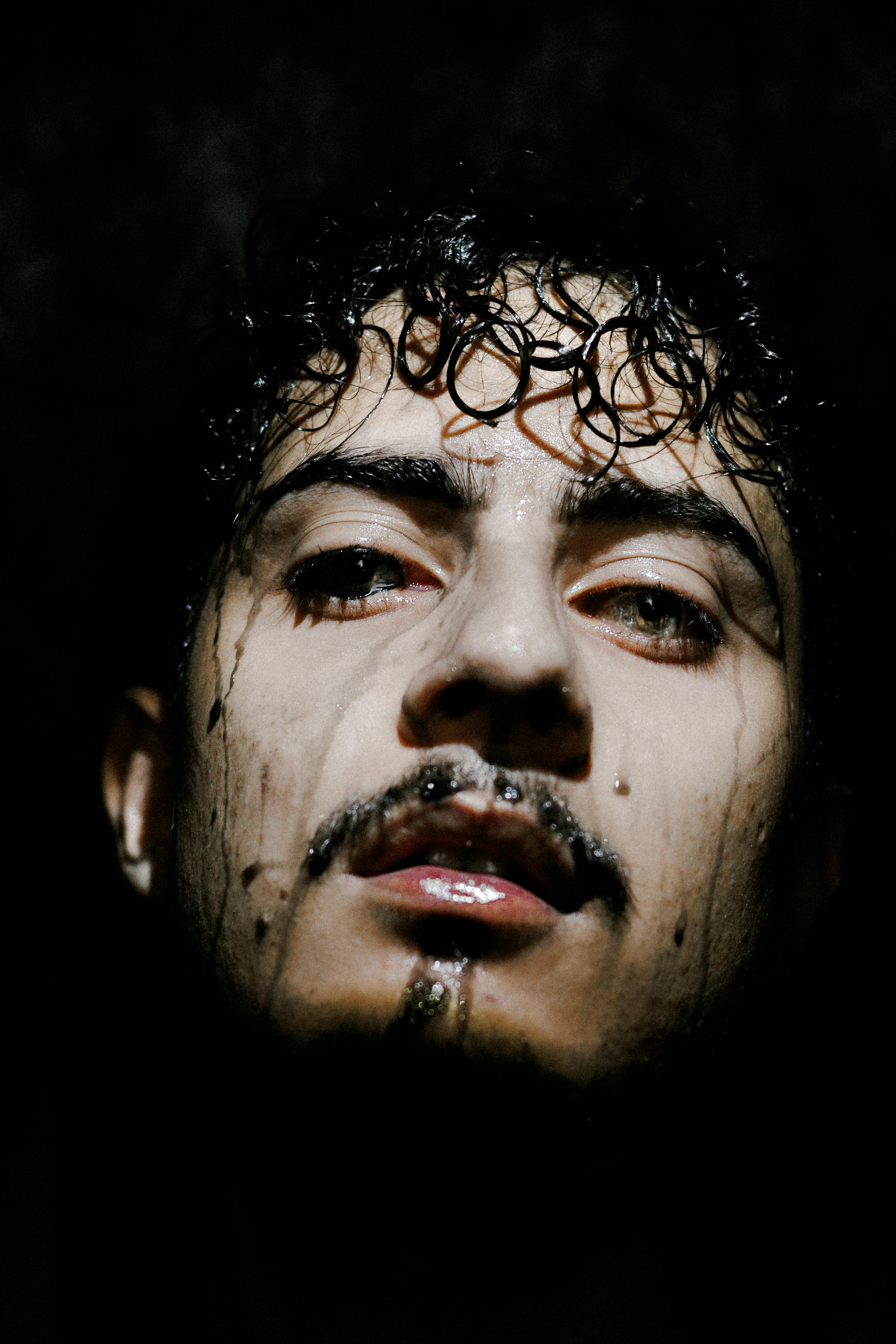 Dramatic Portrait of Wet Person with Intense Expression · Free Stock Photo