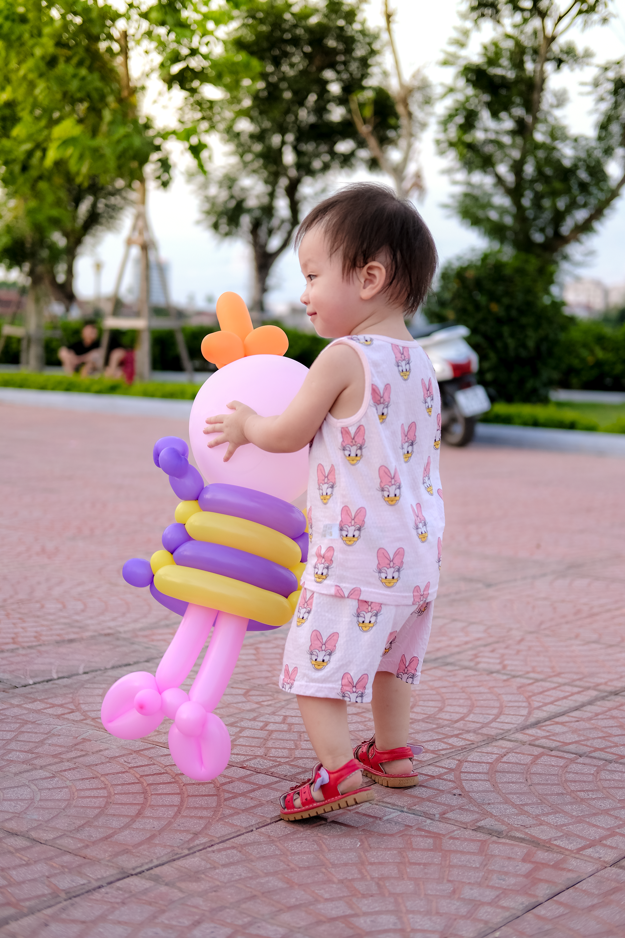 Adorable Child with Colorful Balloon Outdoors · Free Stock Photo