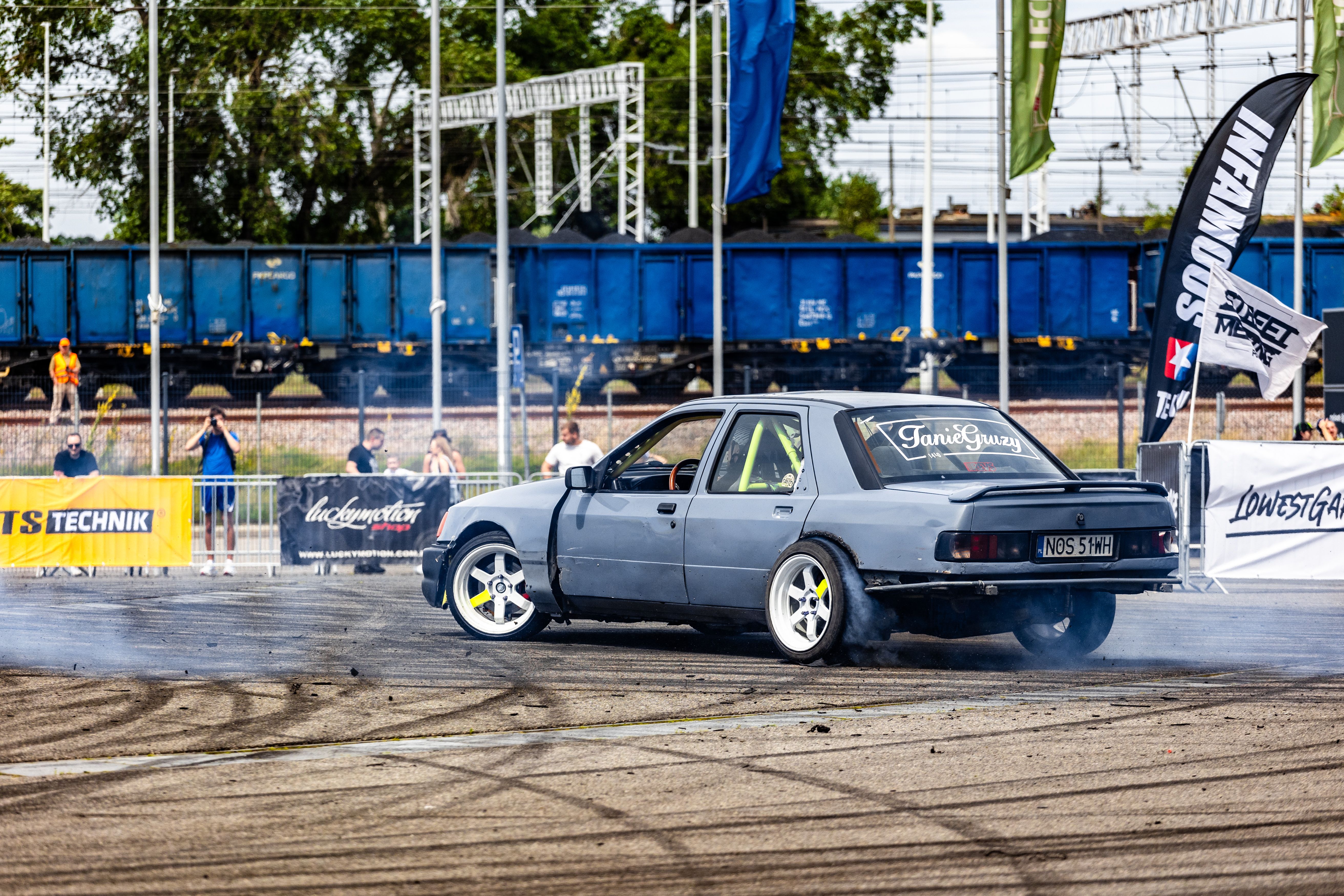 Black Race Car Drifting on Race Track · Free Stock Photo