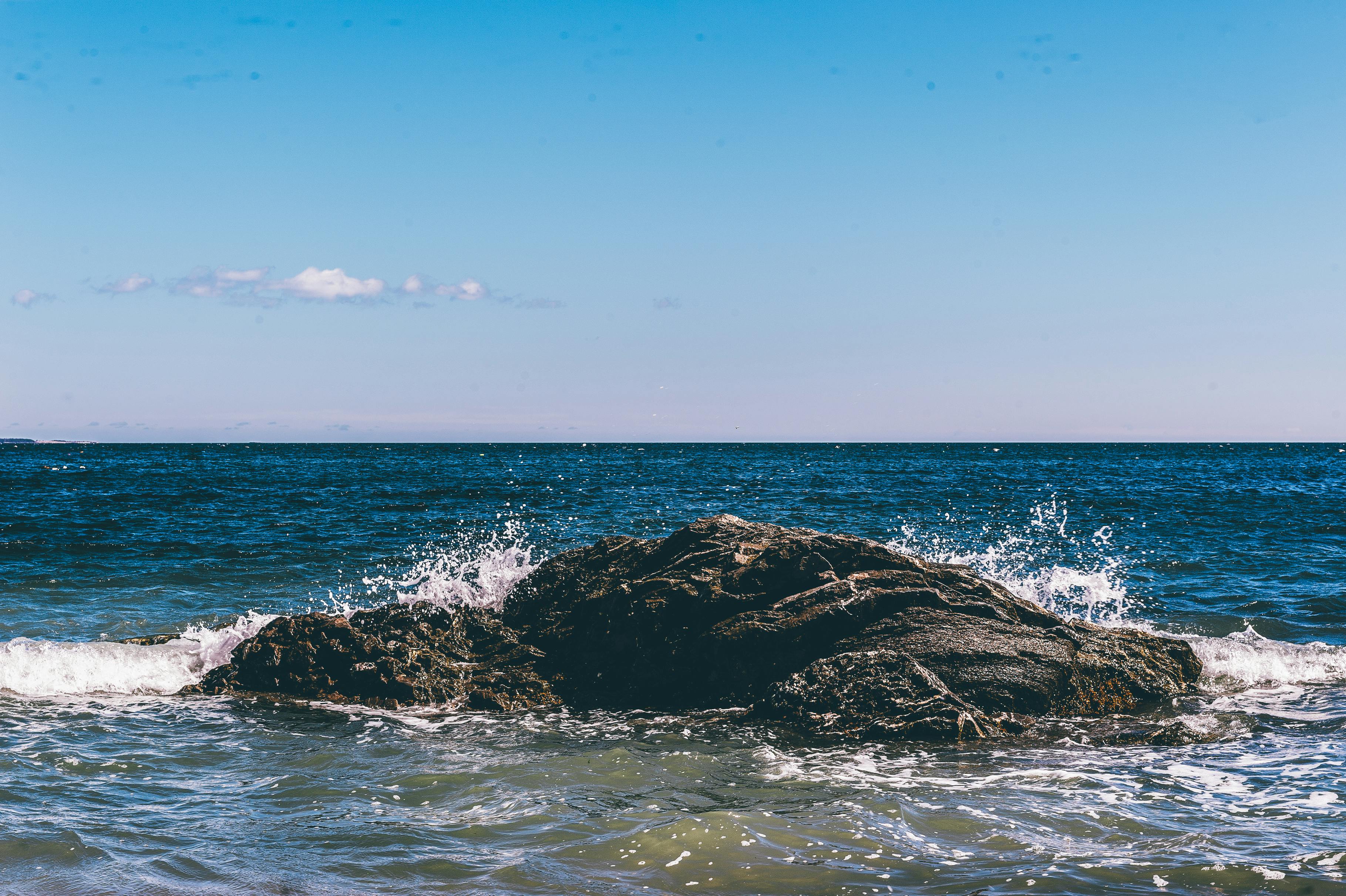 Body of Water With Black Rock · Free Stock Photo