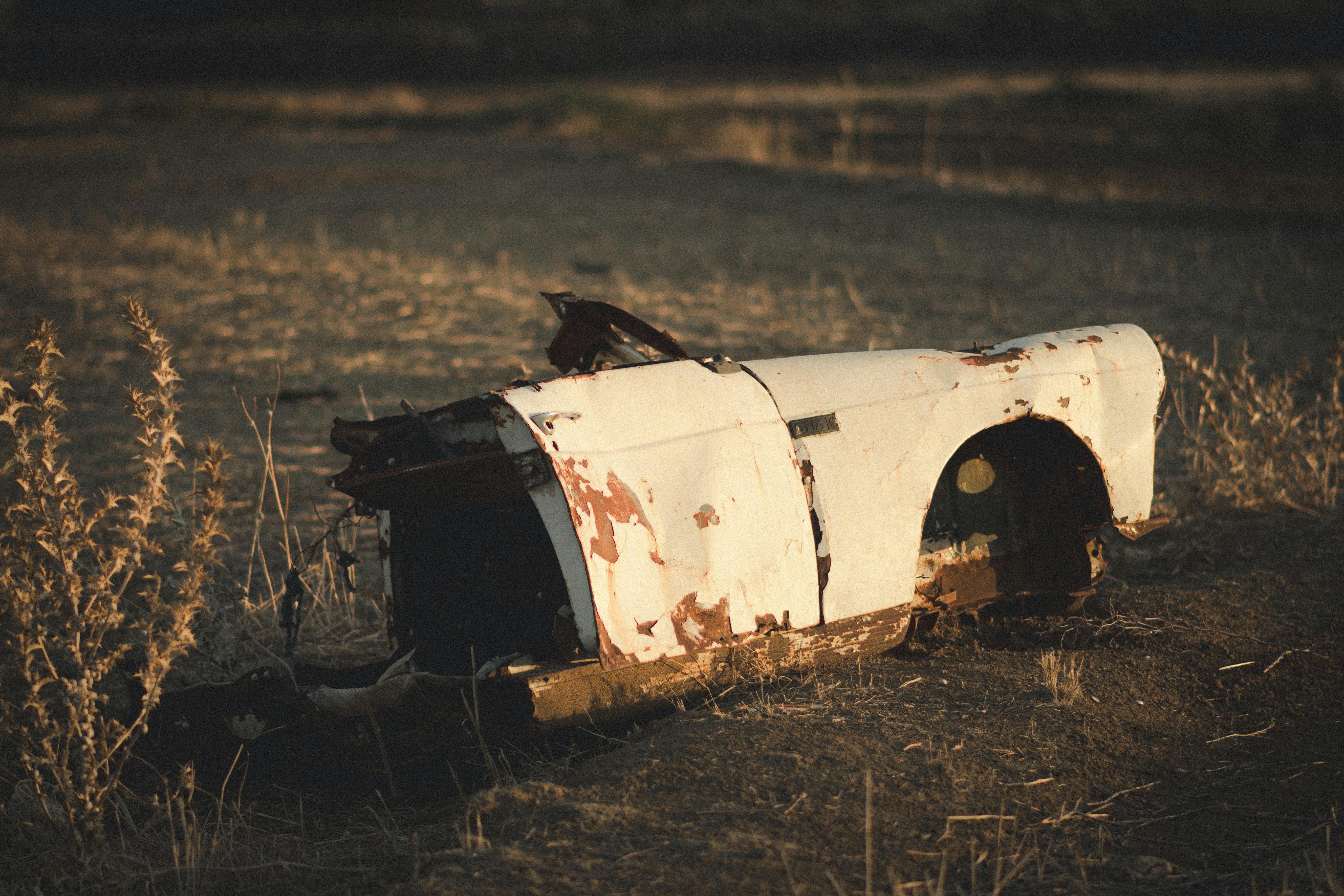 Rusty Car Wreck in Jendouba's Desert Landscape · Free Stock Photo