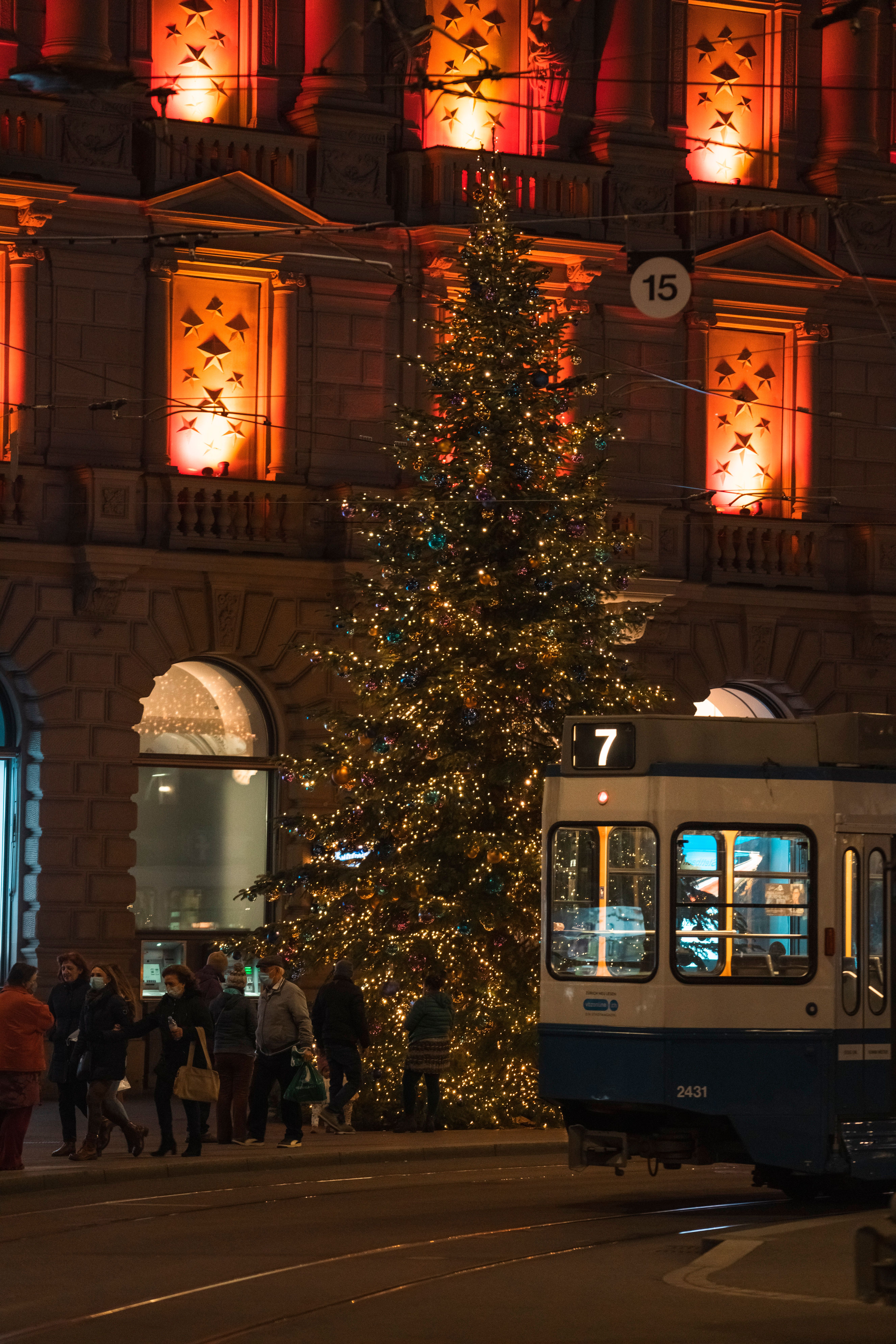 Festive Christmas Street with Tram and Decorations · Free Stock Photo