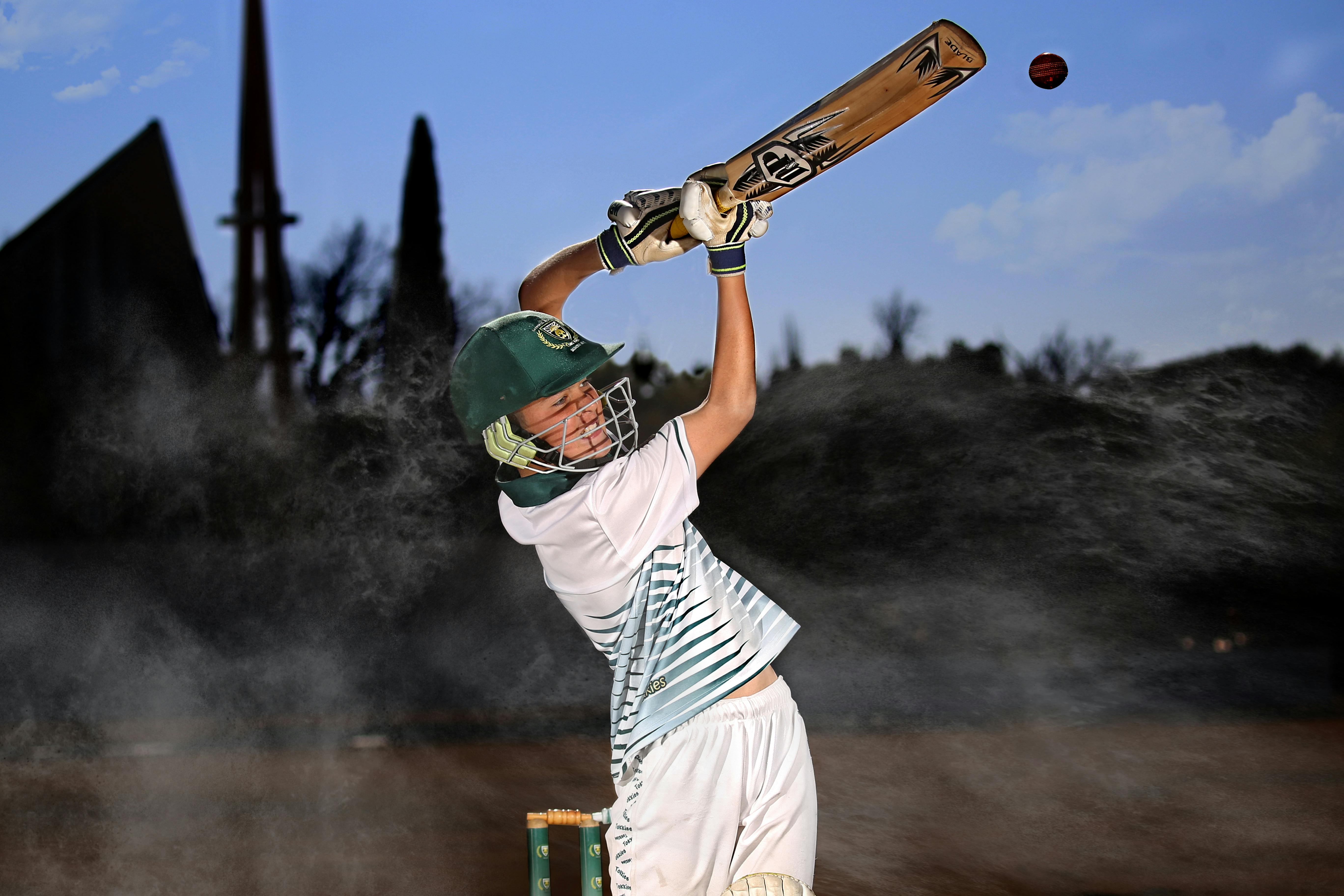 Dynamic Cricket Action with Batsman Swinging Bat · Free Stock Photo