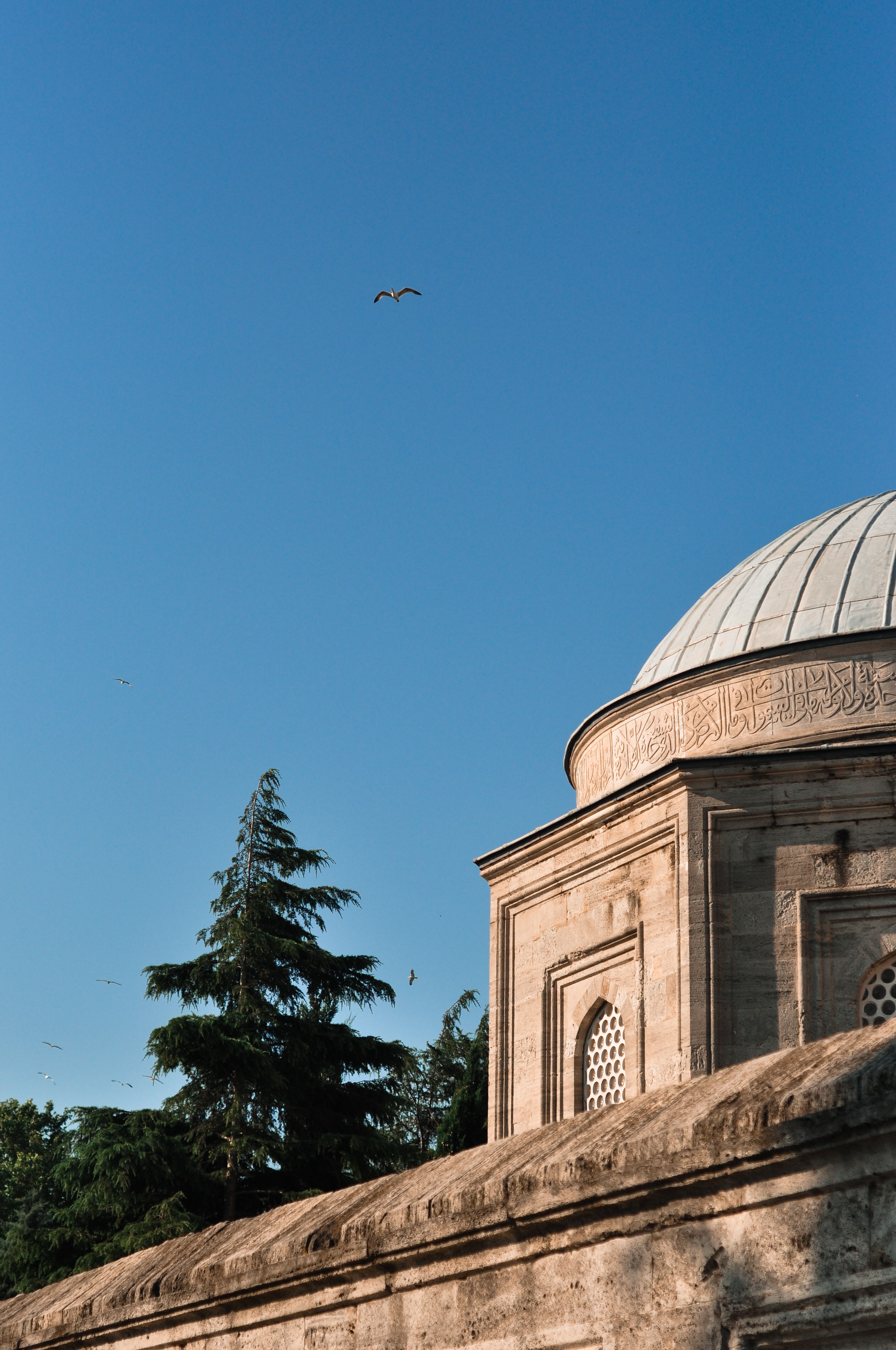 Historic Stone Building with Dome Against Blue Sky · Free Stock Photo