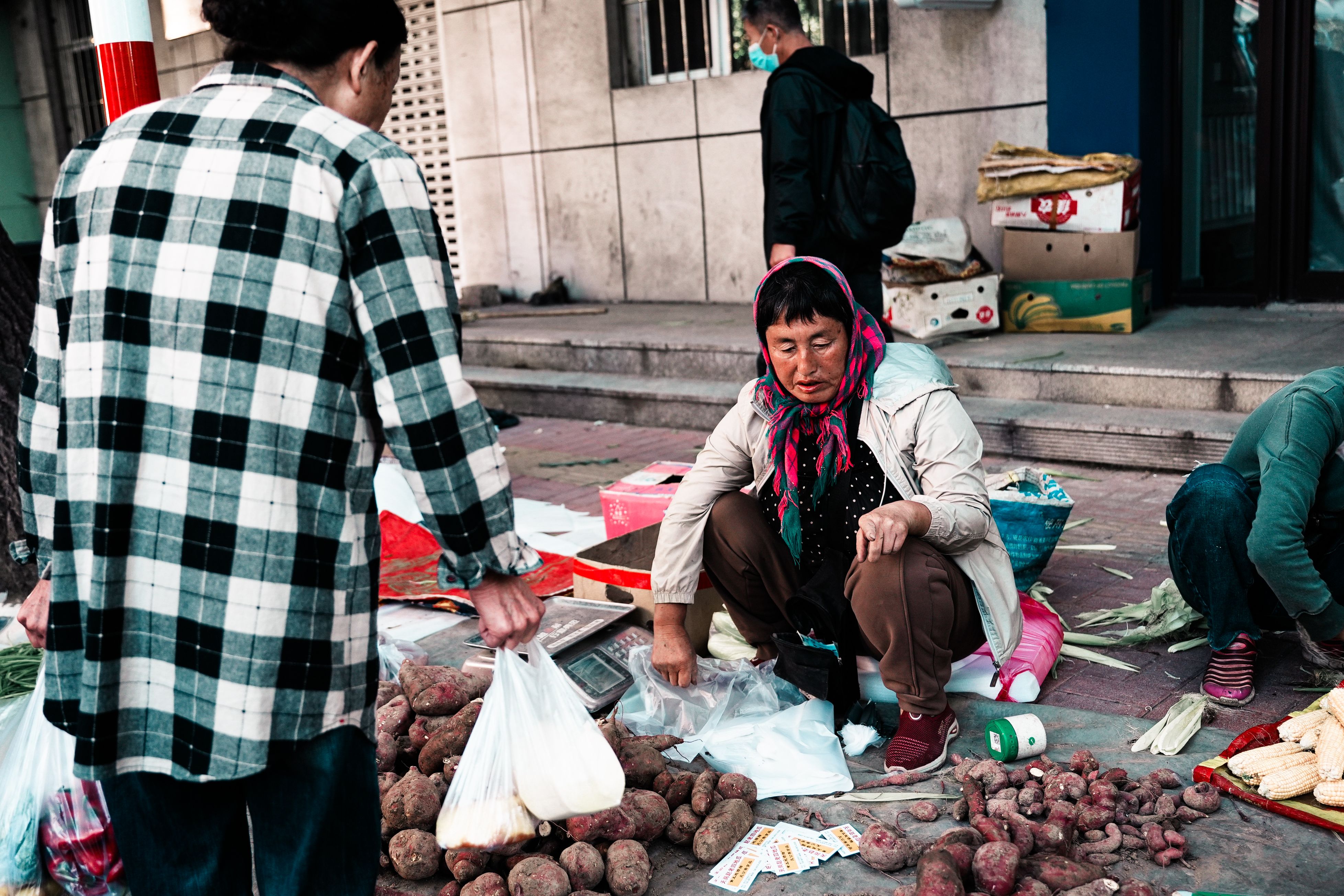 Street Market Vegetable Vendor in Urban Setting · Free Stock Photo