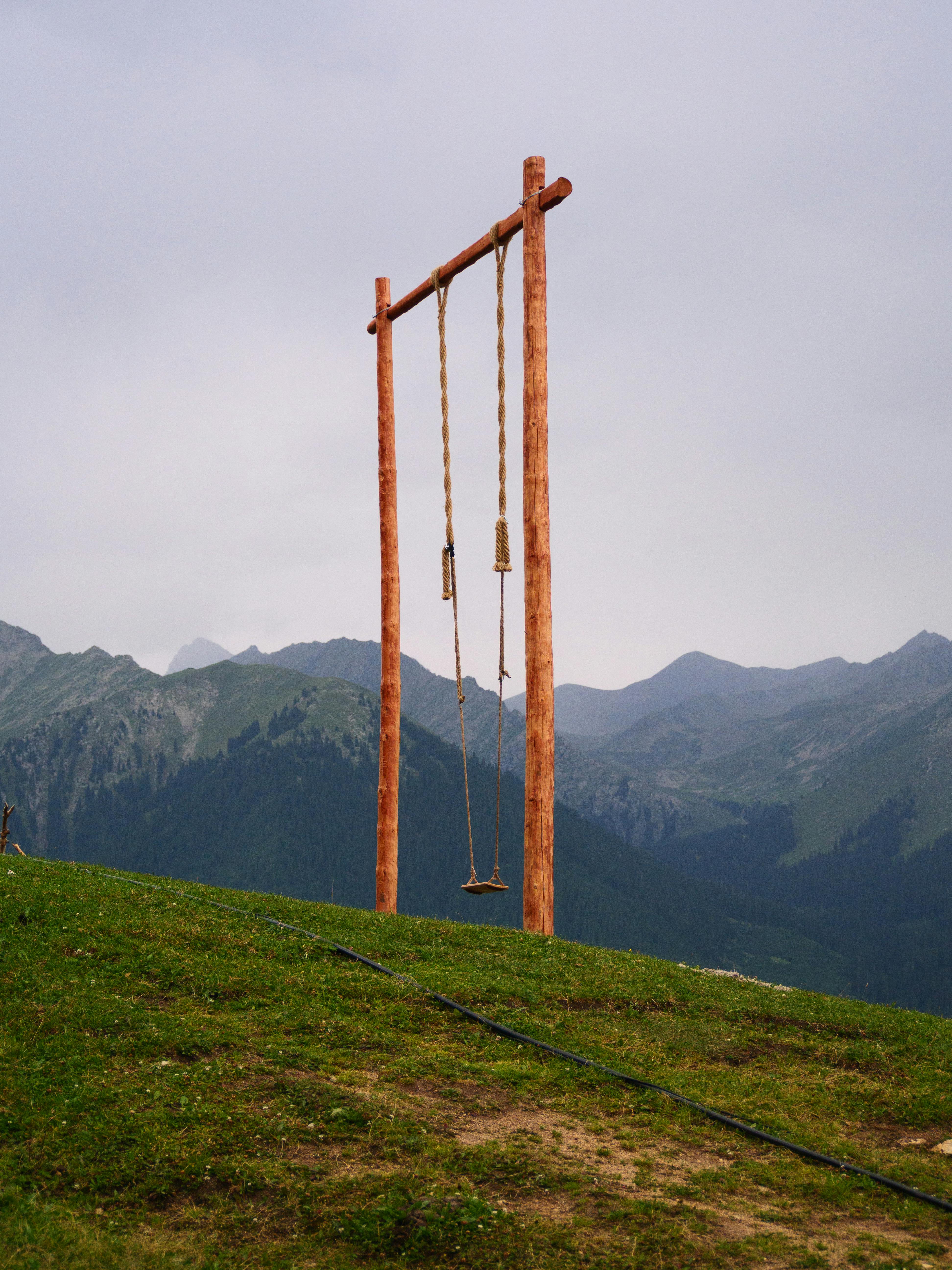 Rustic Swing Overlooking Mountain Landscape · Free Stock Photo