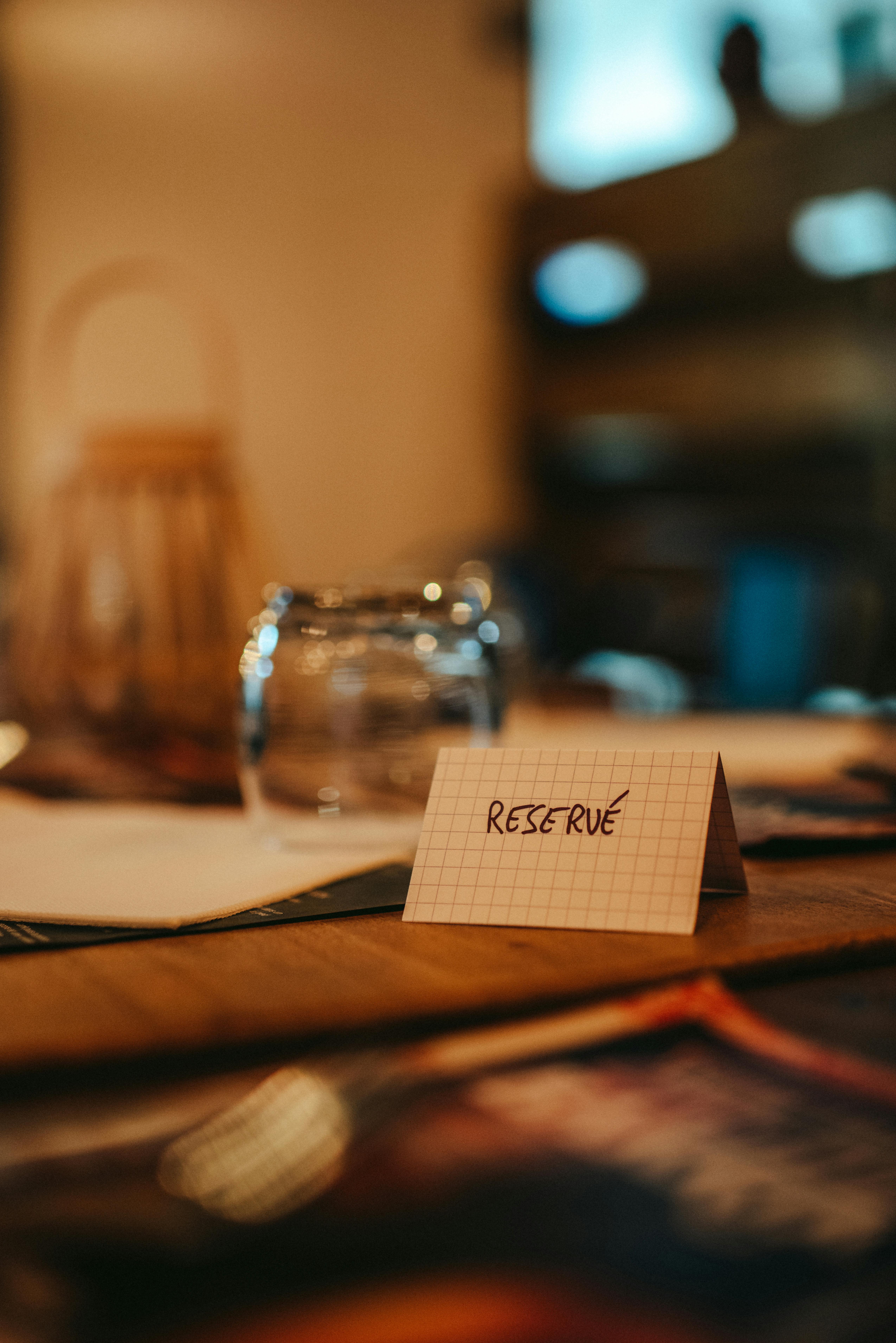 Cozy Restaurant Table with Reservation Card · Free Stock Photo