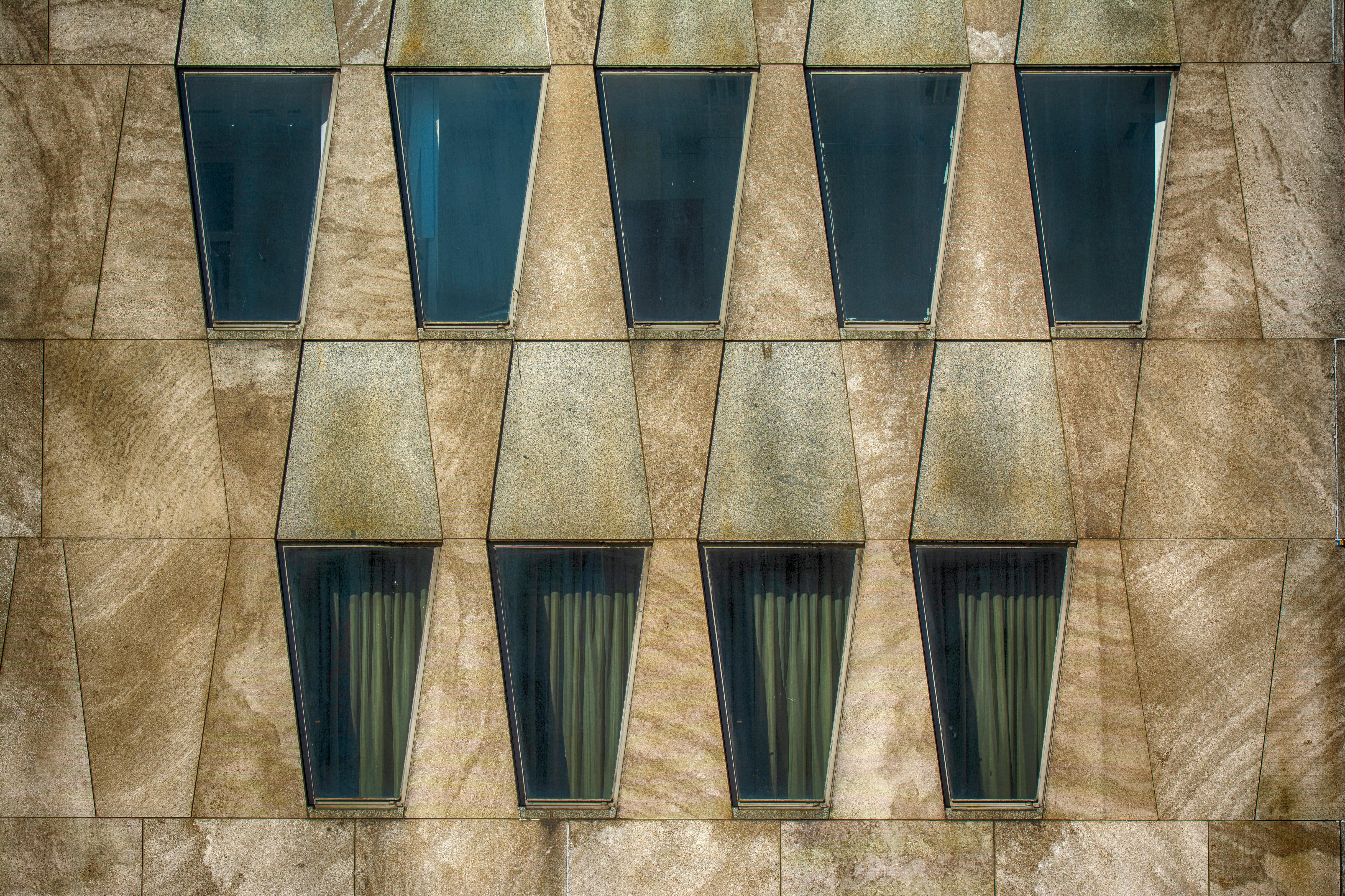 Modern Geometric Facade with Unique Windows · Free Stock Photo