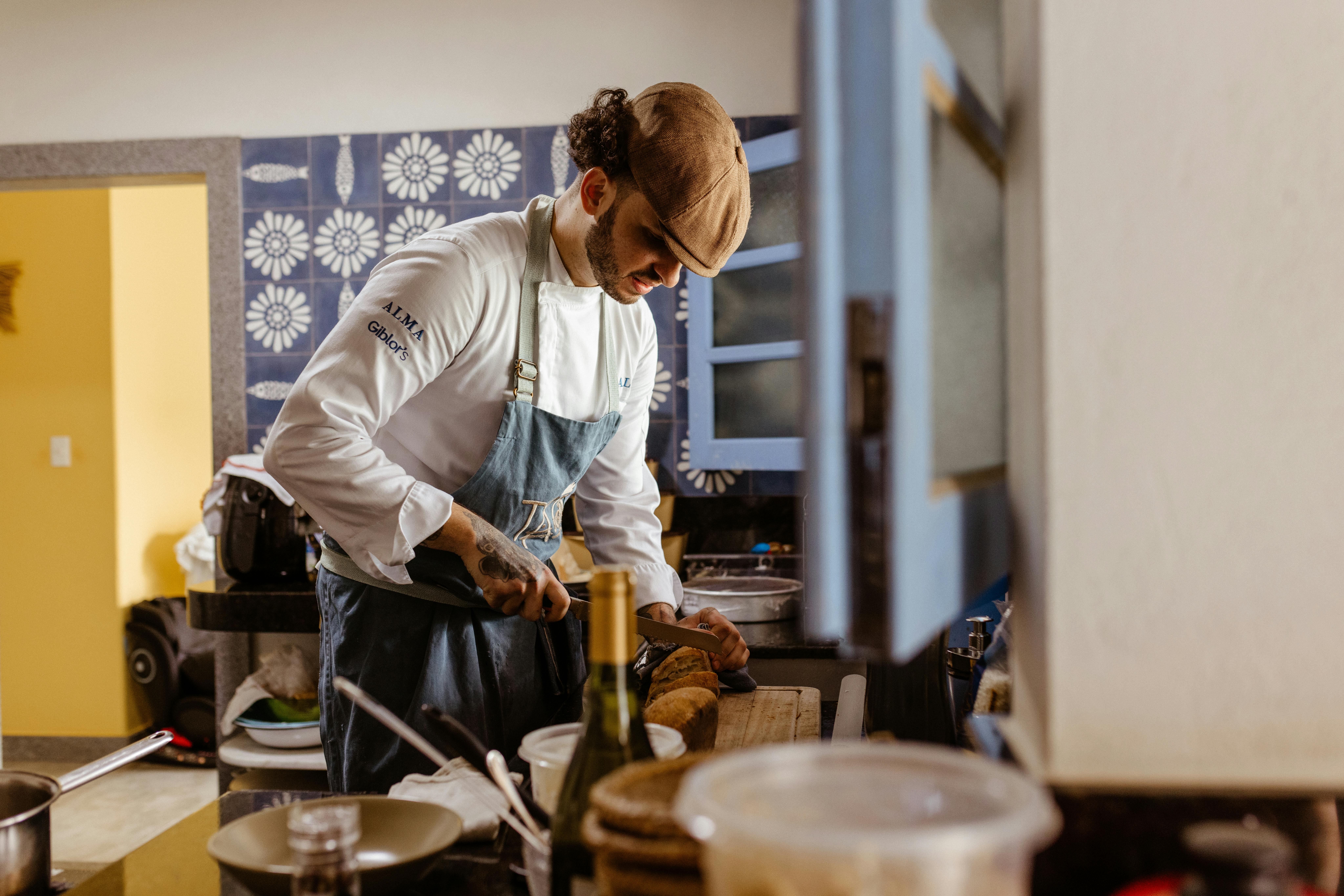 Culinary Chef Preparing Meal in Modern Kitchen · Free Stock Photo