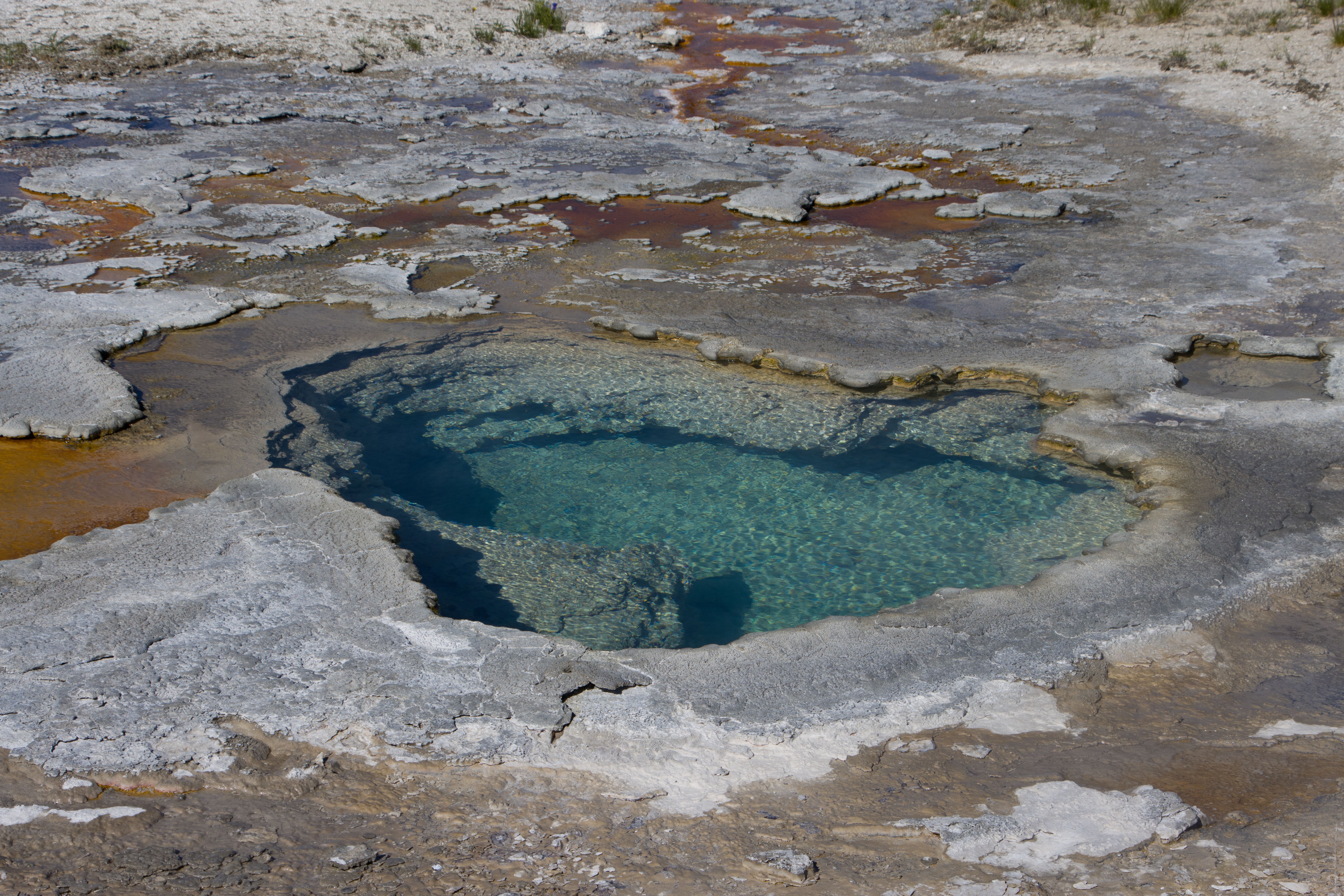 Geothermal Hot Spring in Natural Rocky Setting · Free Stock Photo