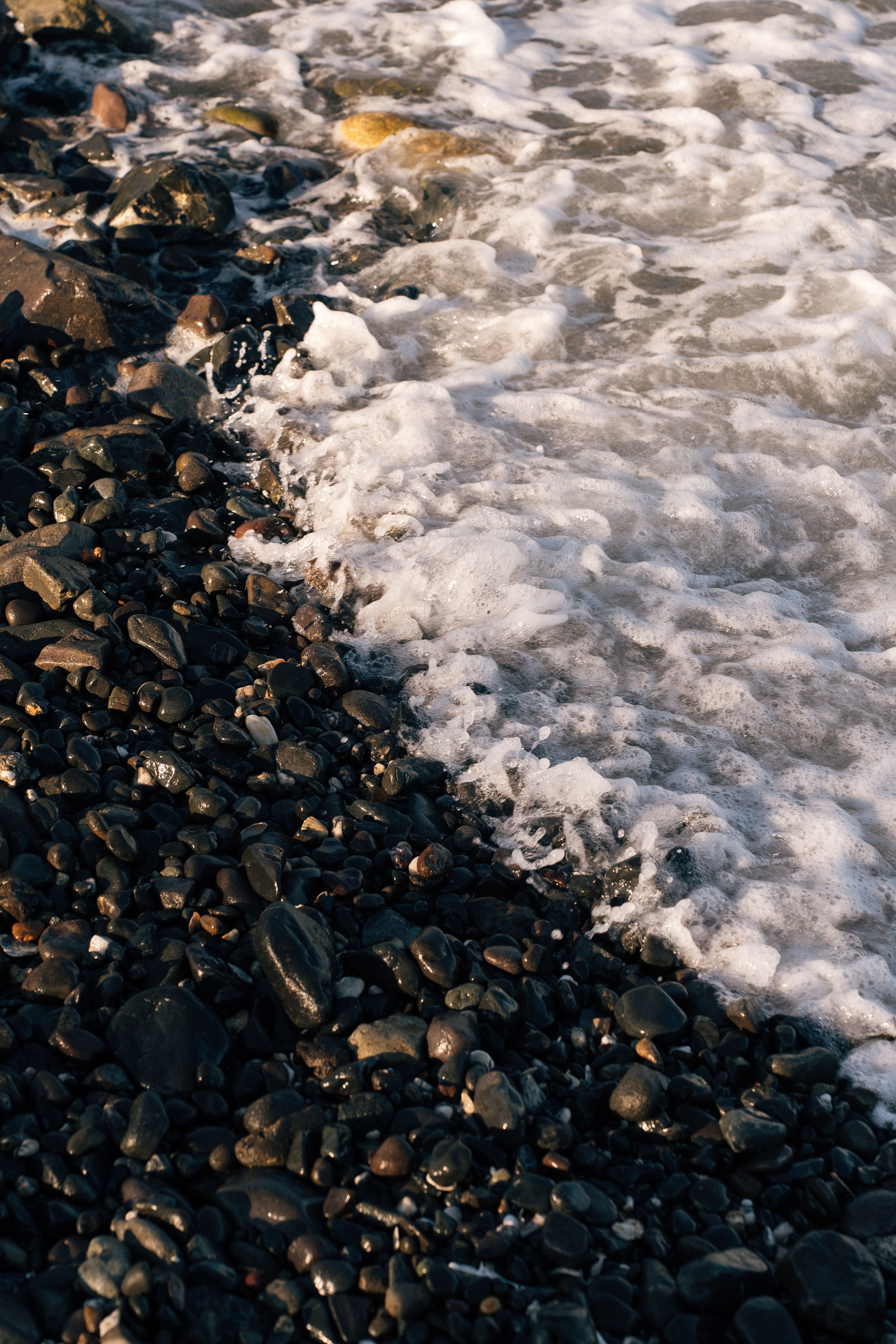 Pebble Beach with Ocean Waves at Sunrise · Free Stock Photo