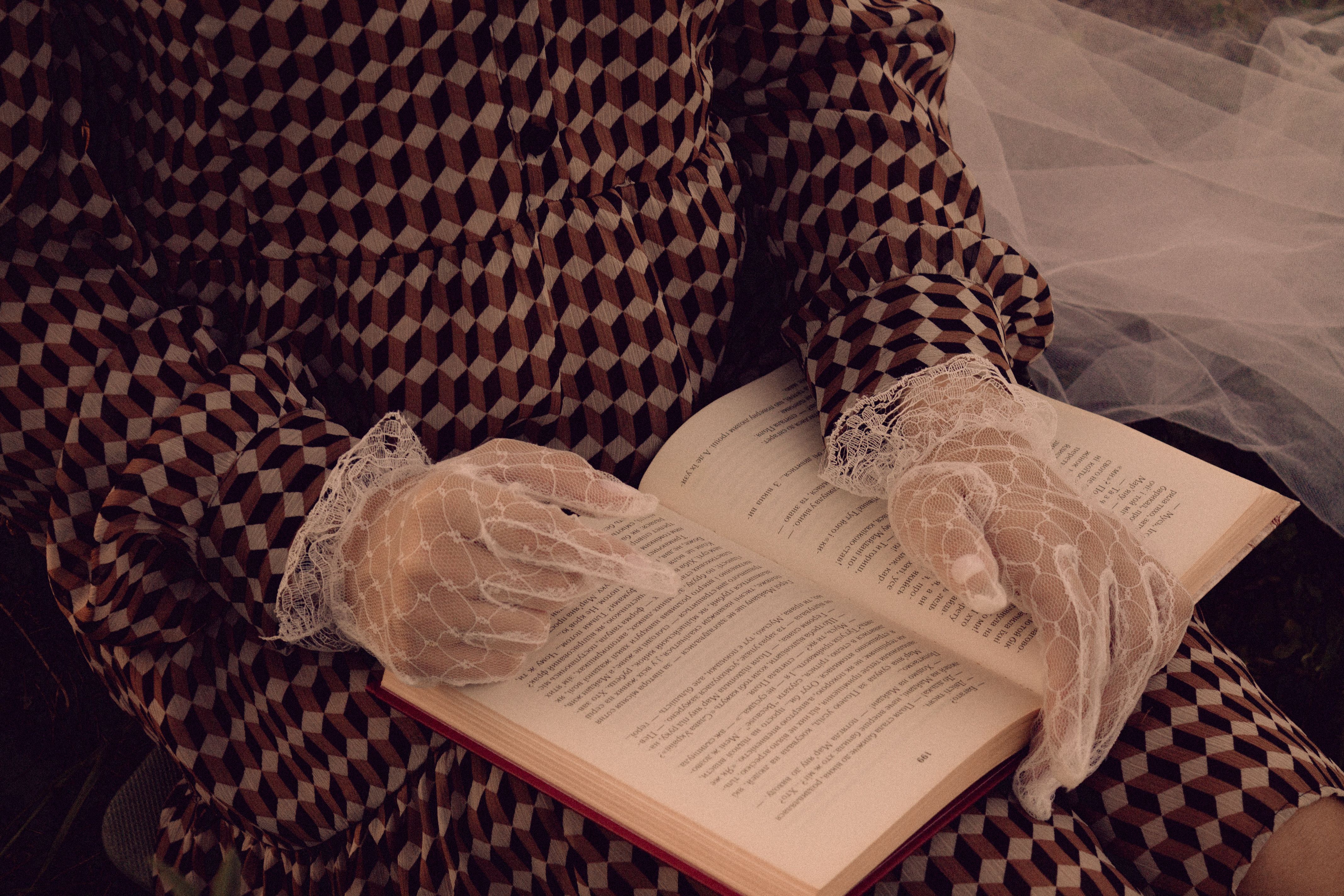 Vintage Style Reading with Lace Gloves · Free Stock Photo