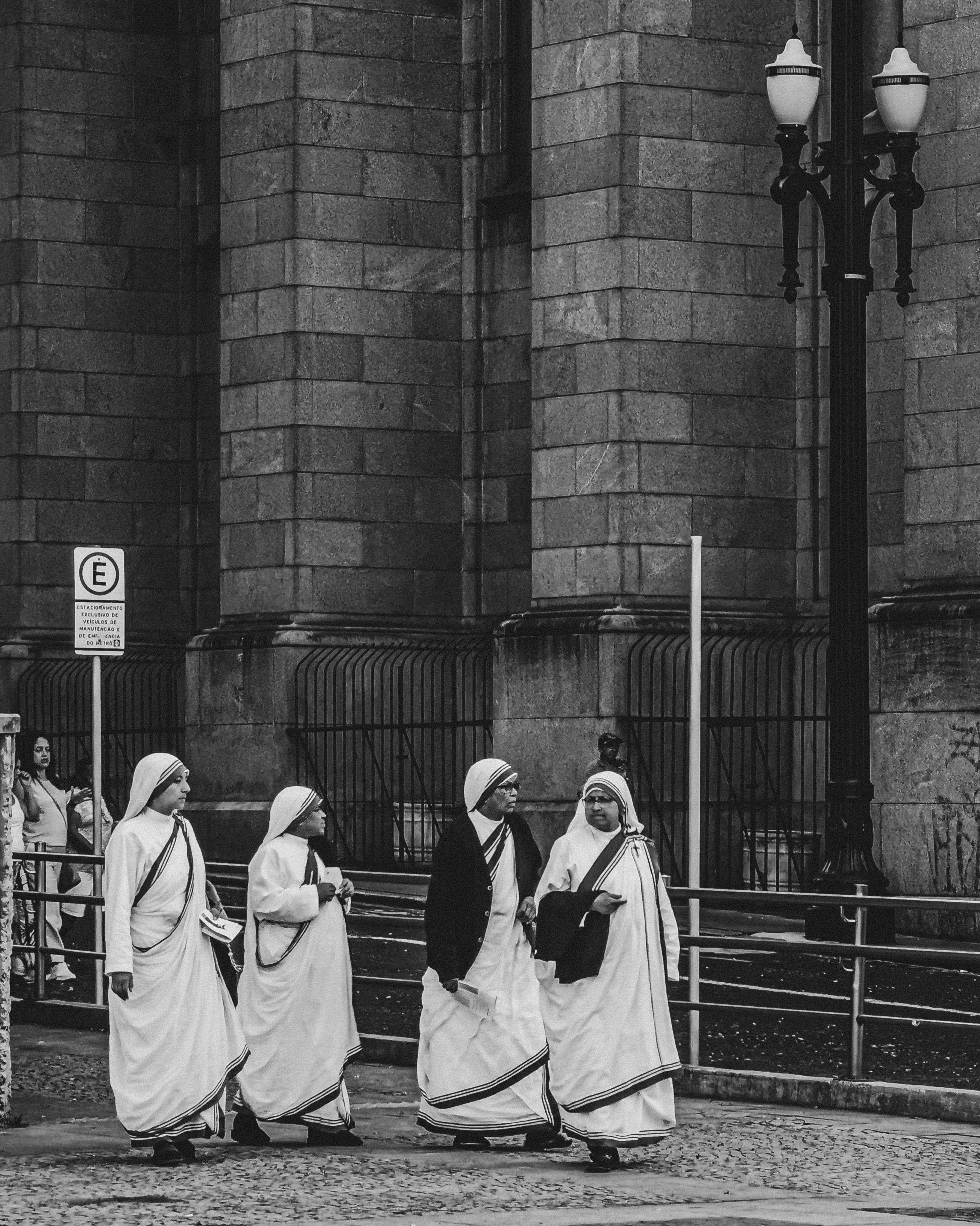 Group of Nuns Walking by Historic Building · Free Stock Photo