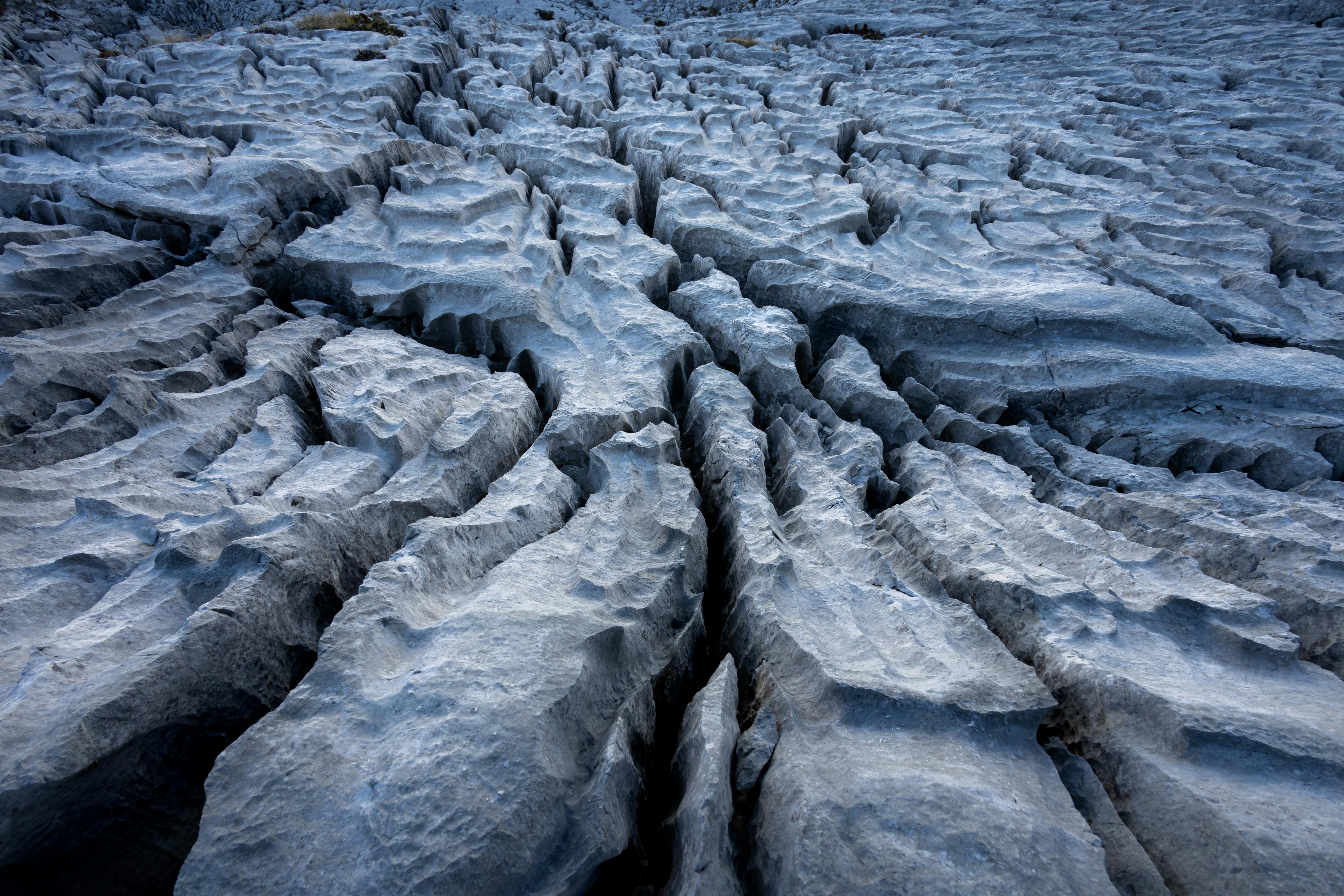 Textured Surface of Weathered Limestone Formation · Free Stock Photo