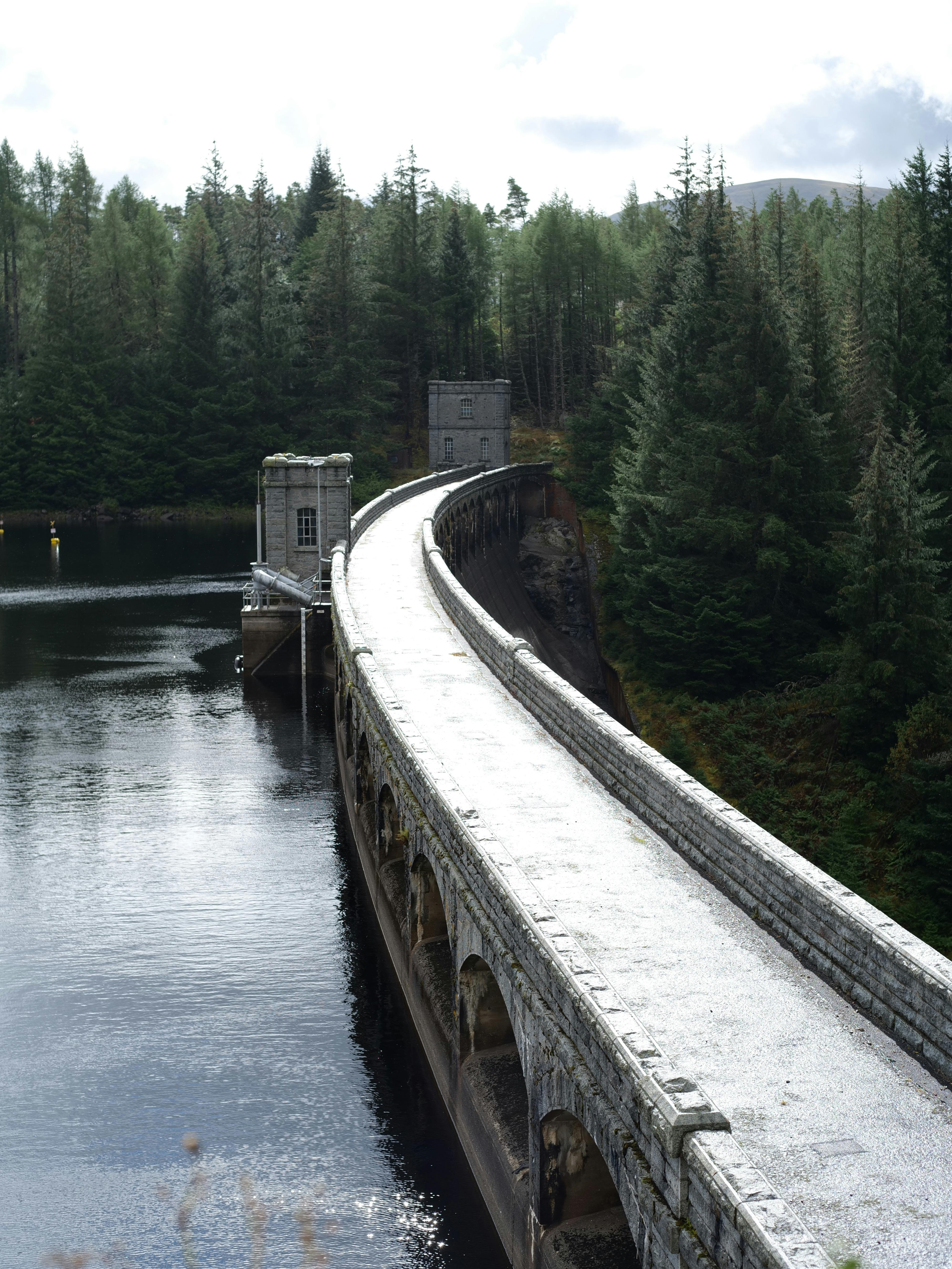 Scenic view of arched stone bridge over water · Free Stock Photo