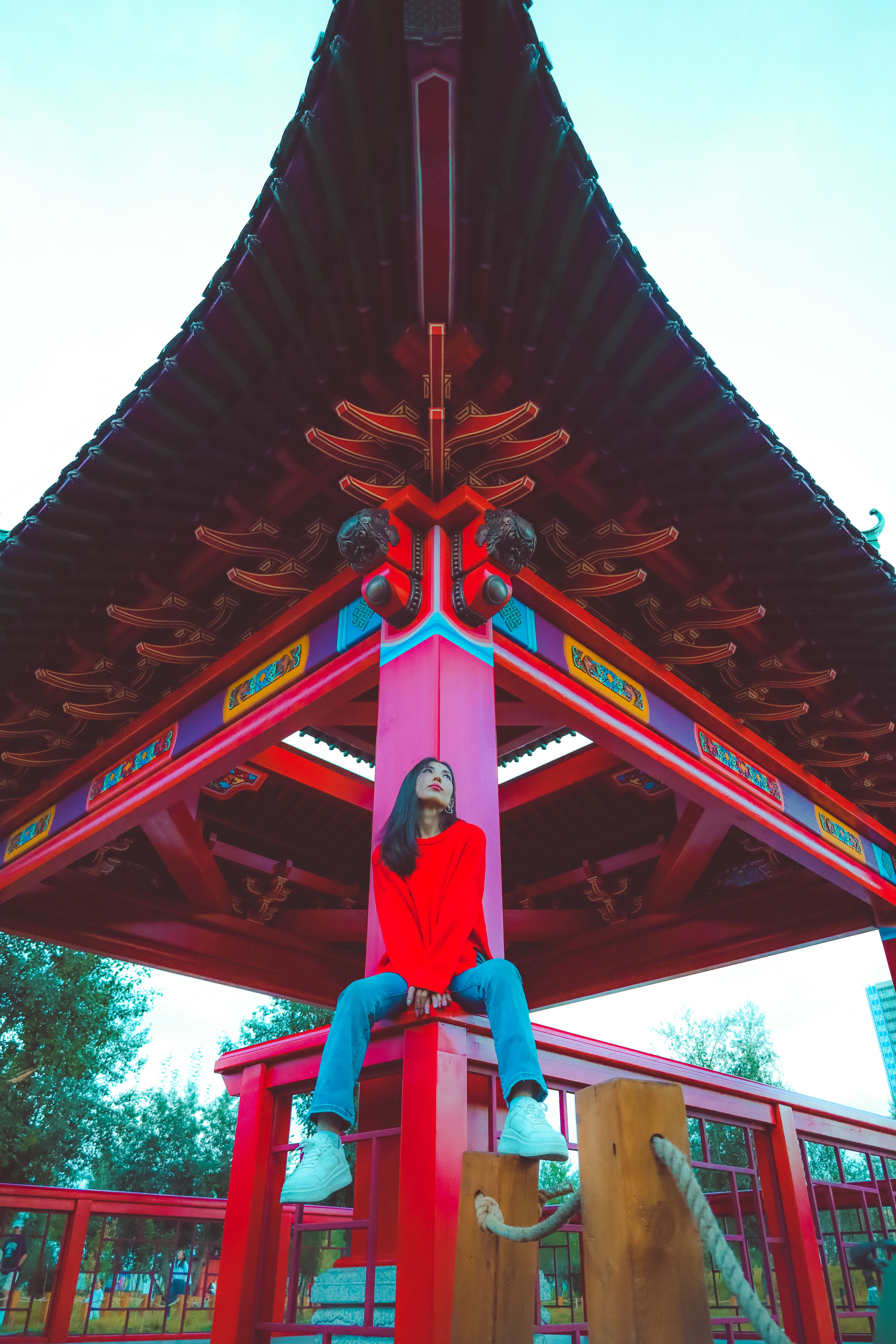 Person Underneath Vibrant Red Asian Pavilion · Free Stock Photo