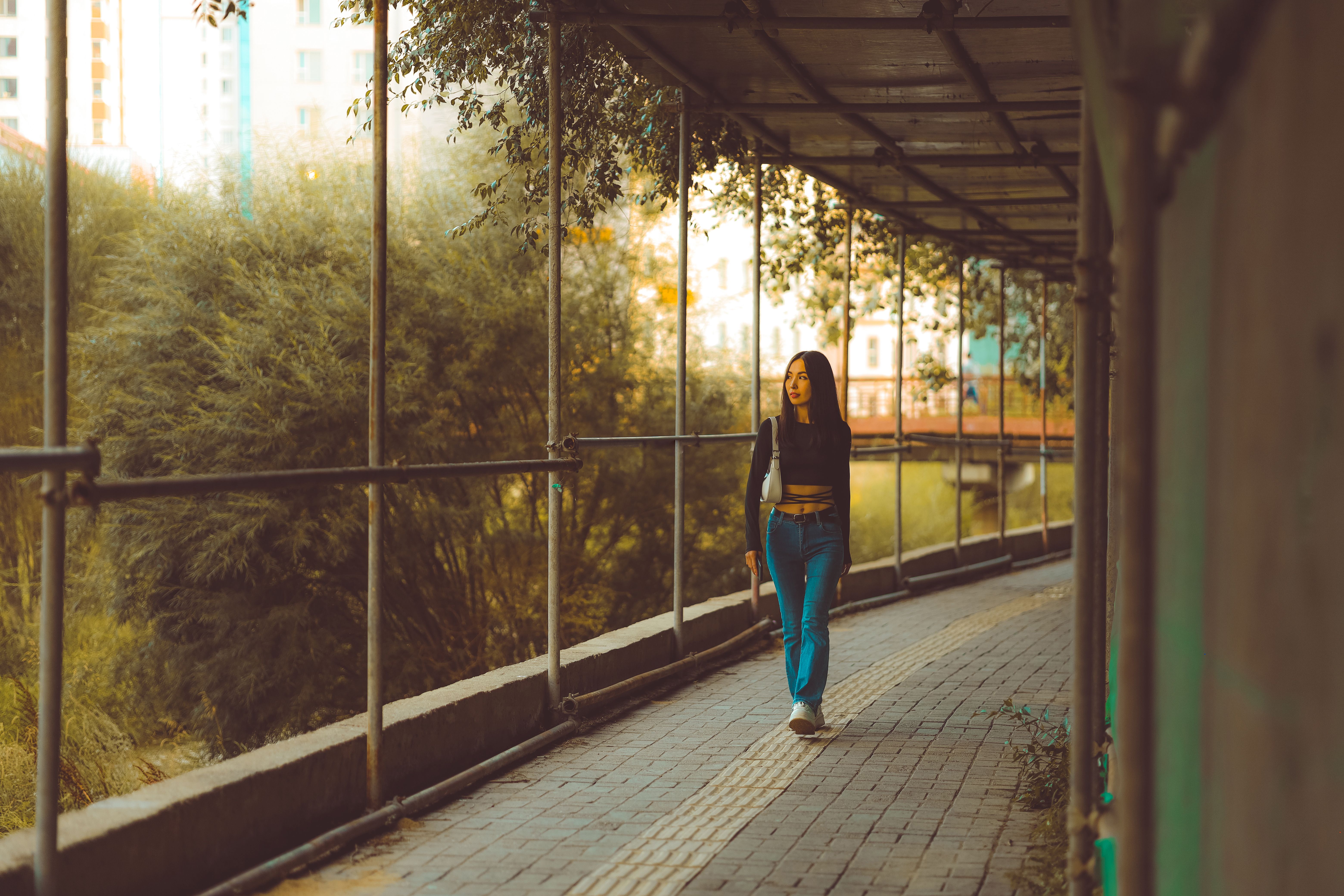 Woman Walking in Urban Outdoor Pathway · Free Stock Photo