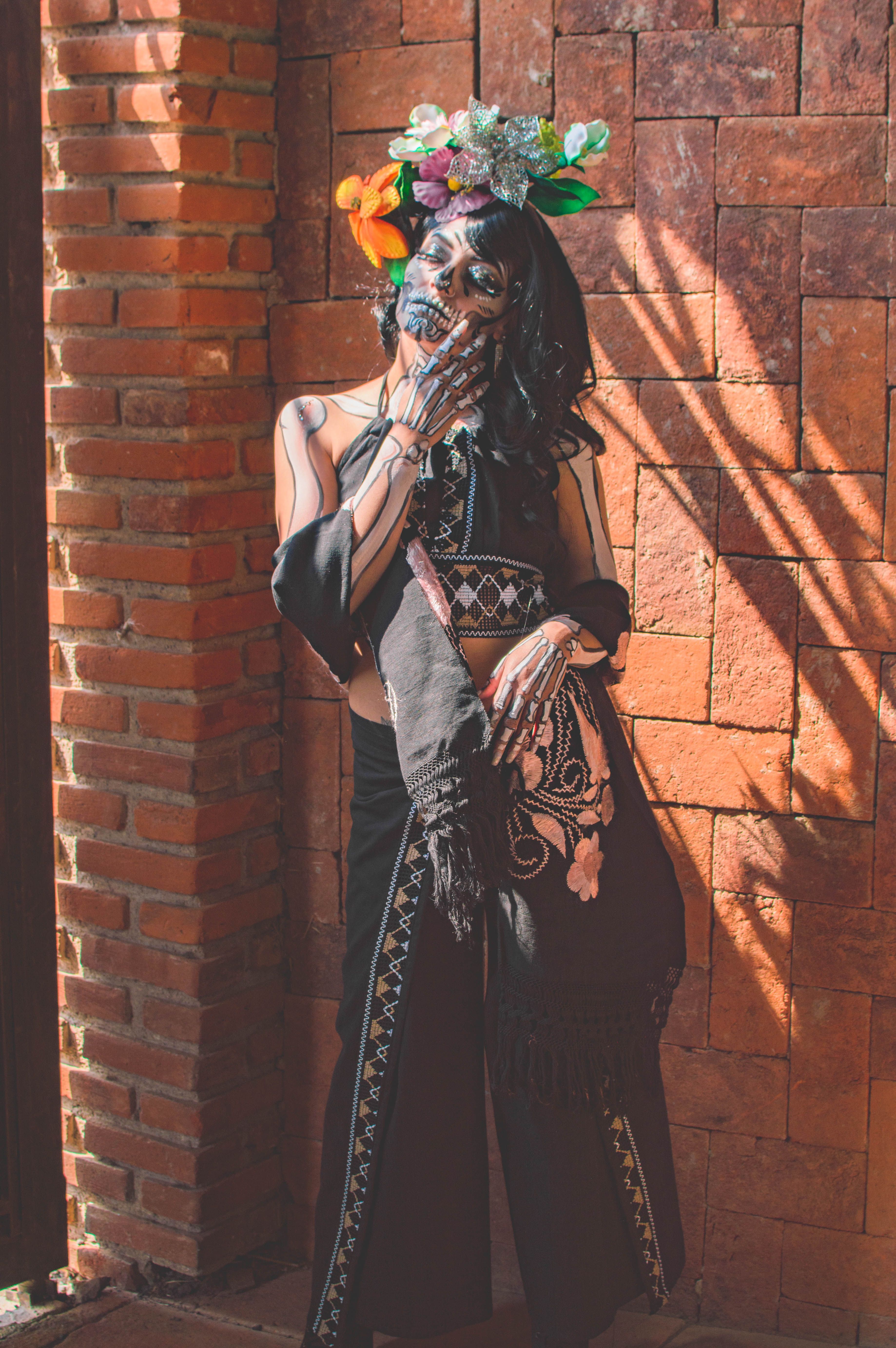 Traditional Mexican Catrina in Sunlit Dress · Free Stock Photo