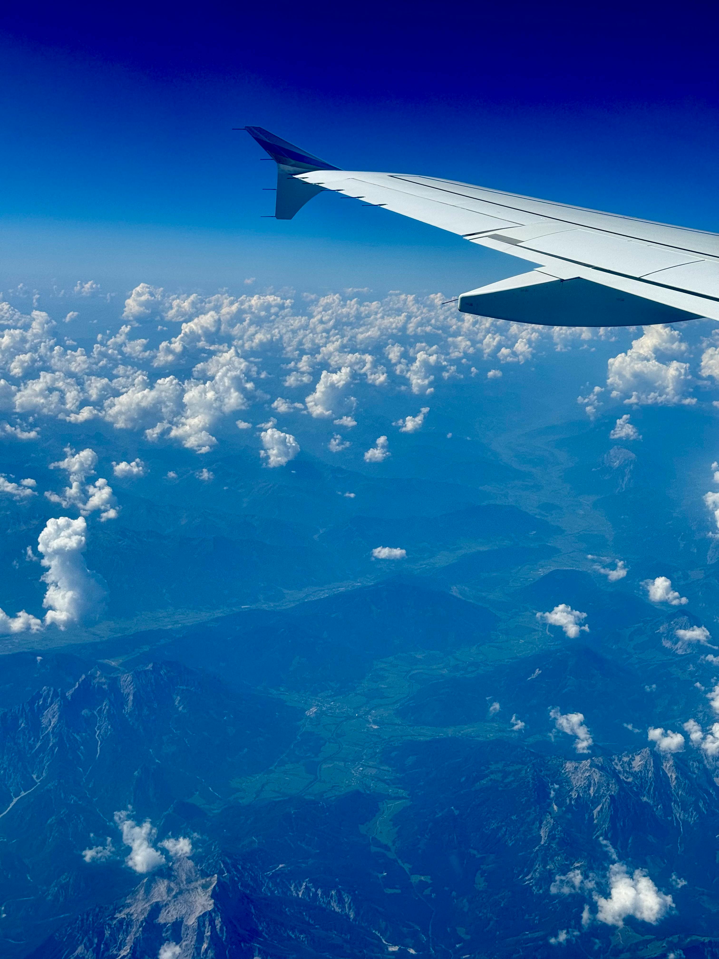 Aerial View of Mountainous Terrain from Airplane · Free Stock Photo