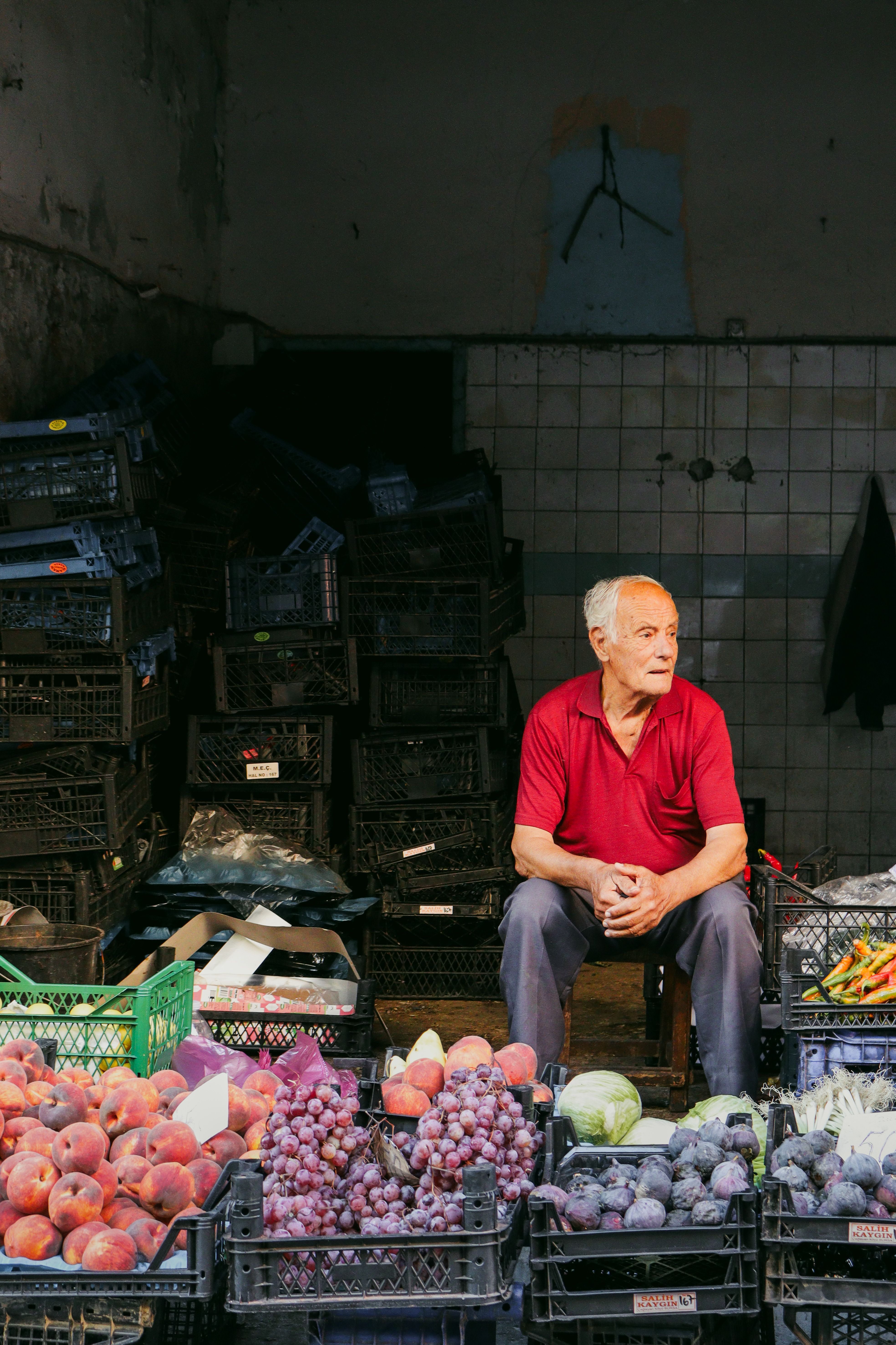 Elderly Man at Istanbul Fruit Market Stall · Free Stock Photo