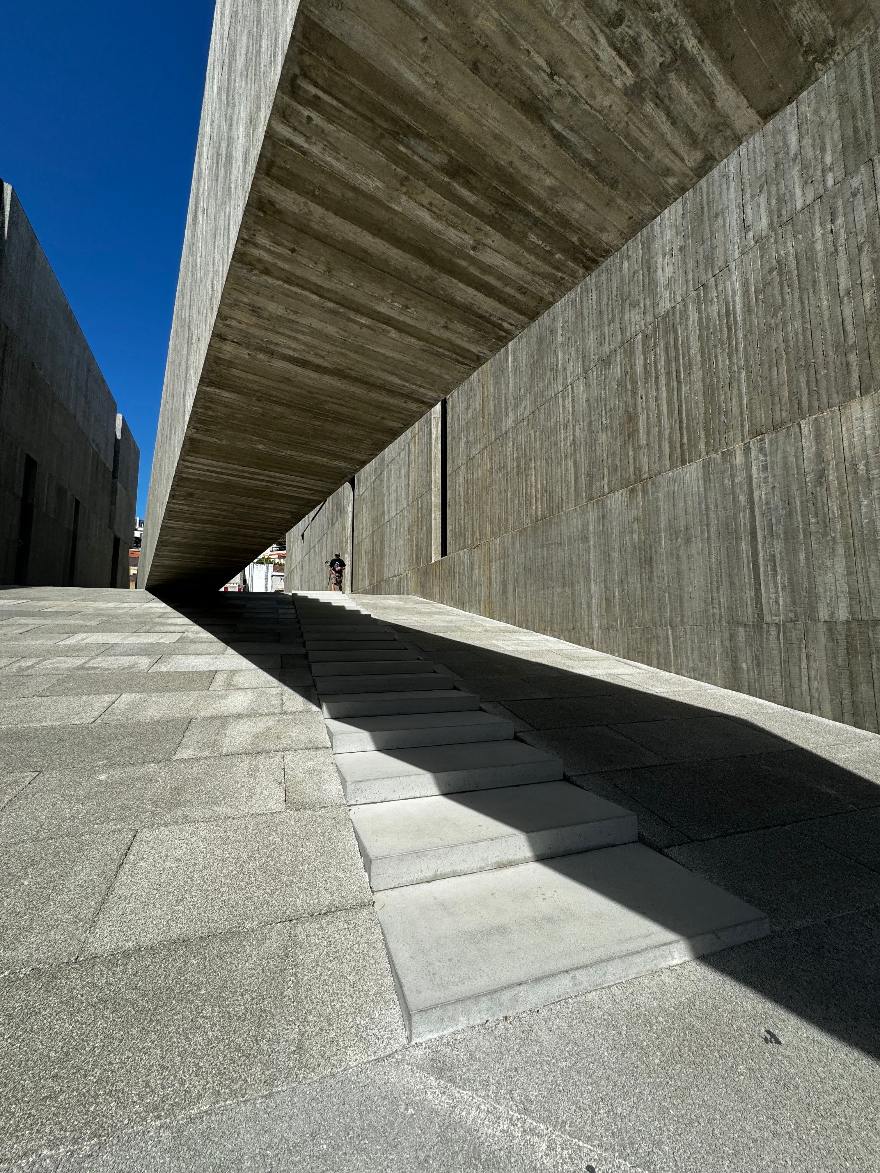 Modern architectural pathway with shadows · Free Stock Photo