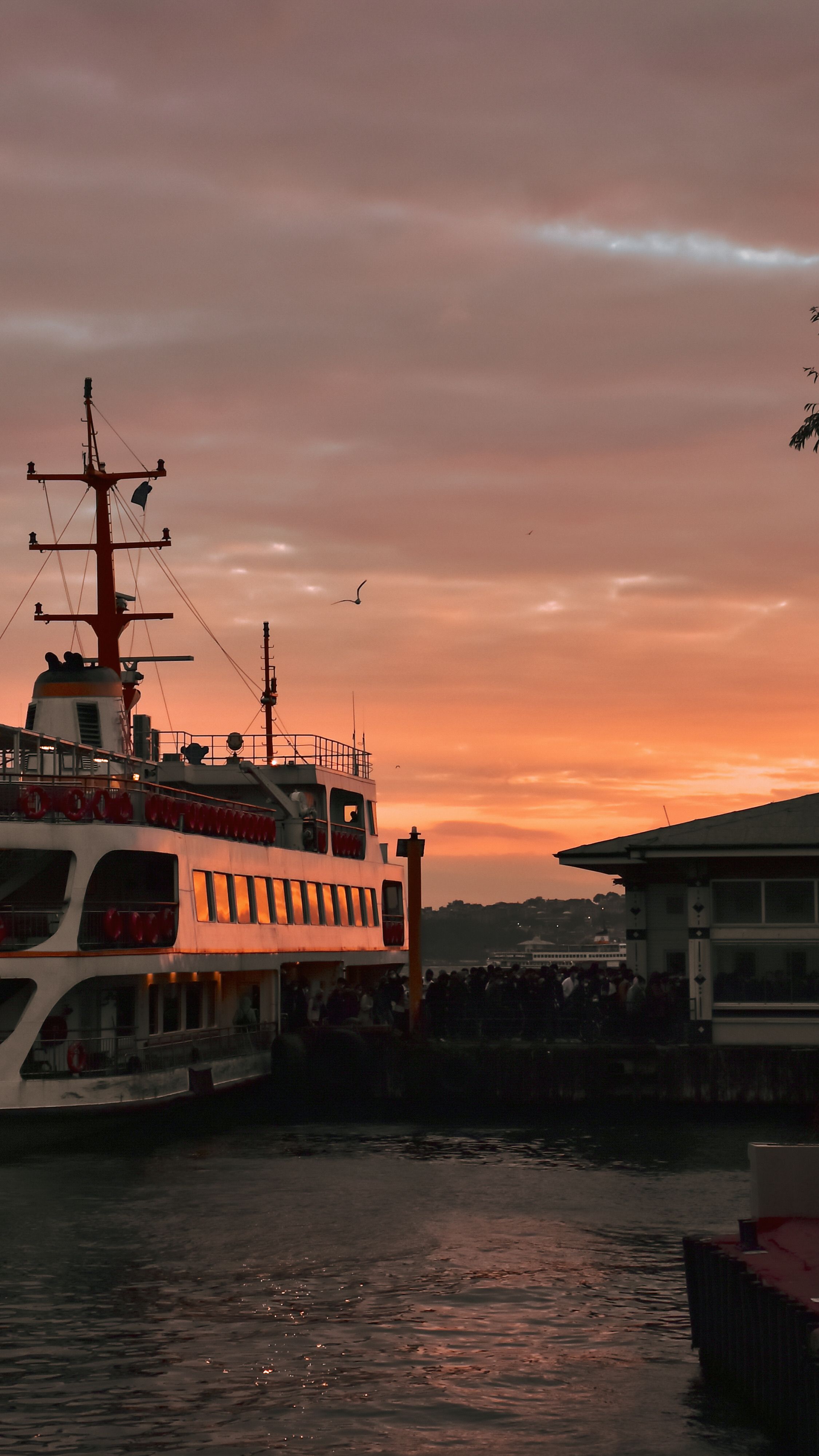 Ferry at Sunset in Serene Harbor Mid-Dock · Free Stock Photo