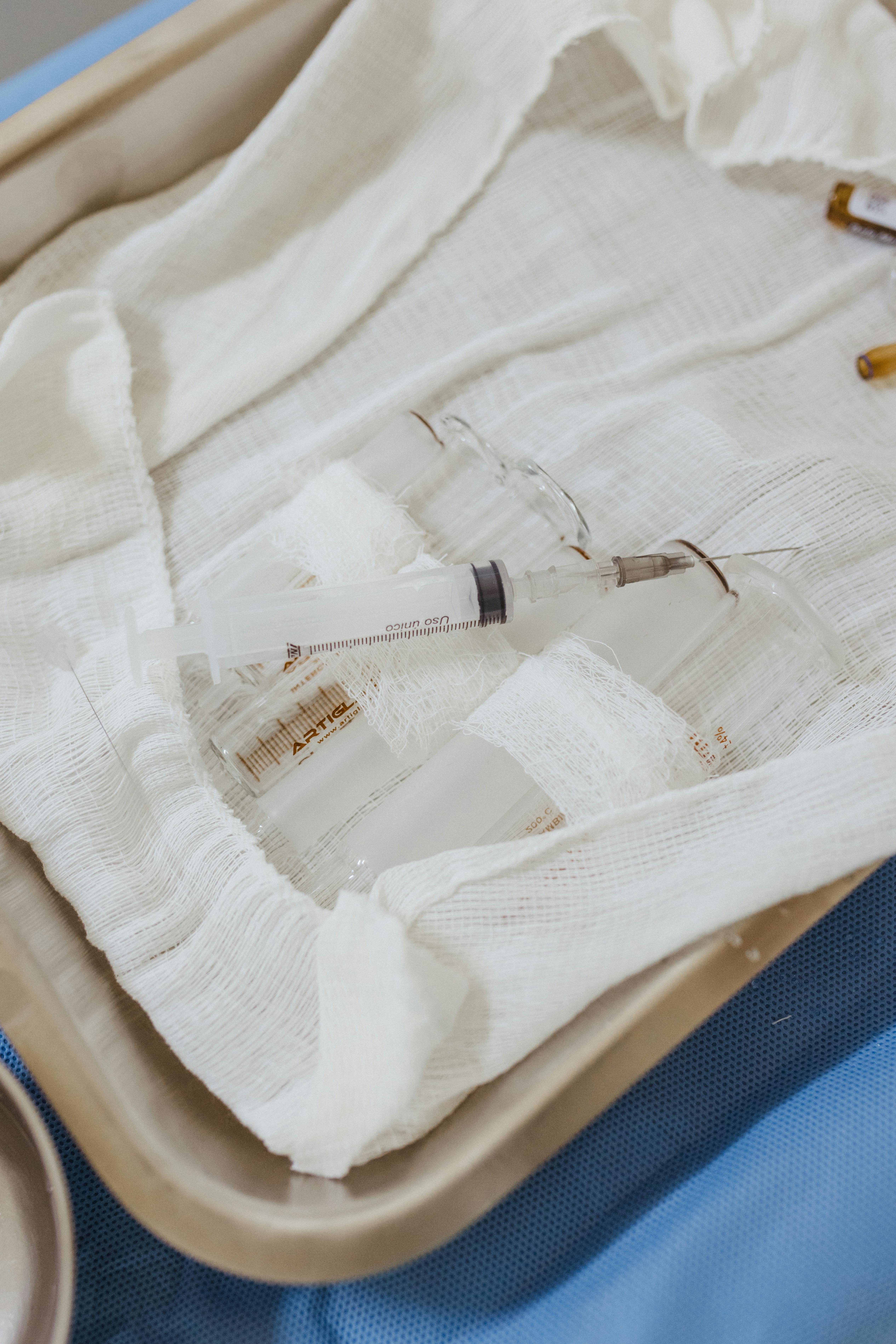 Medical Syringe on Sterile Tray in Hospital Setting · Free Stock Photo