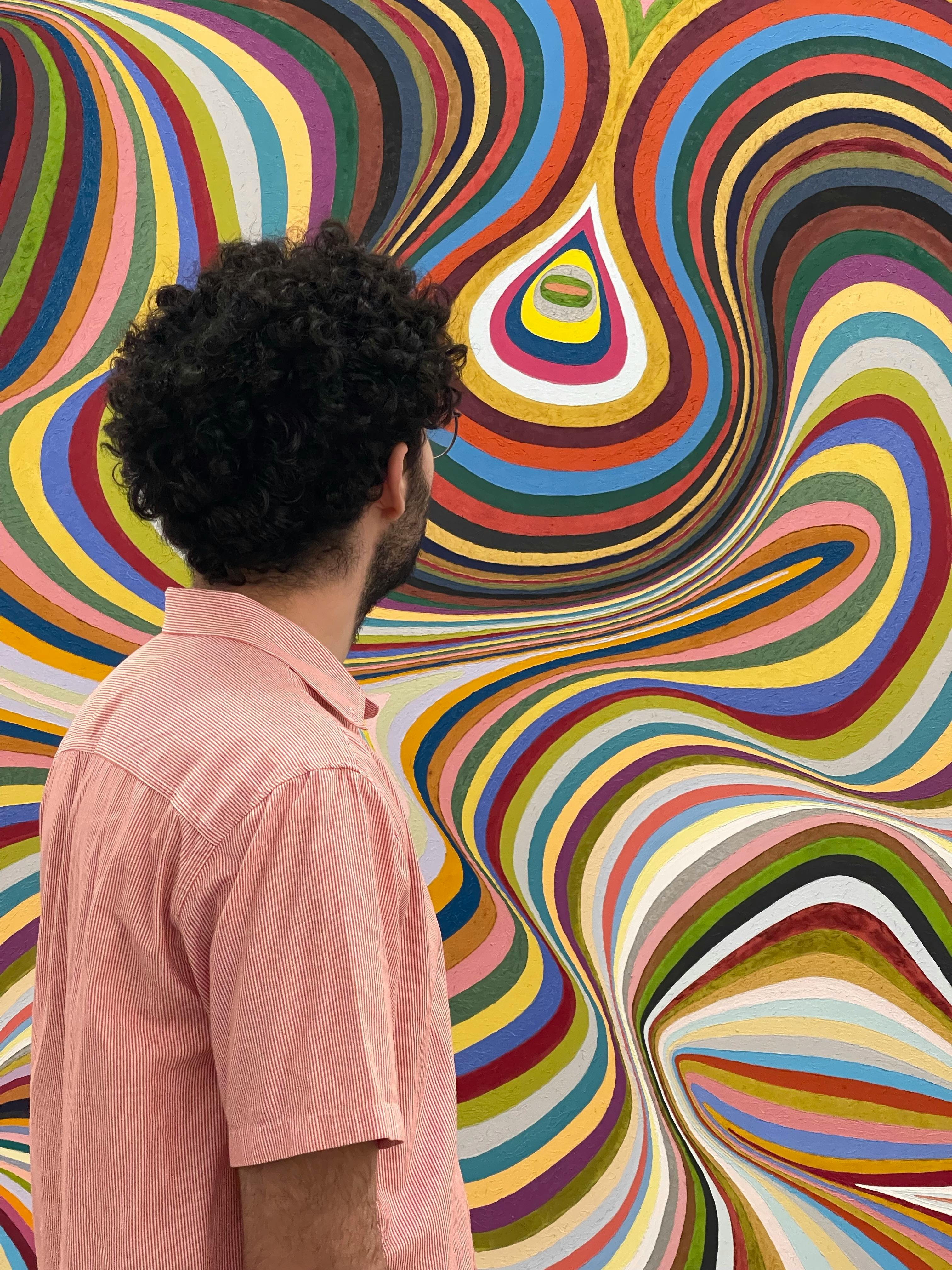 Man Observing Colorful Abstract Art in Gallery · Free Stock Photo