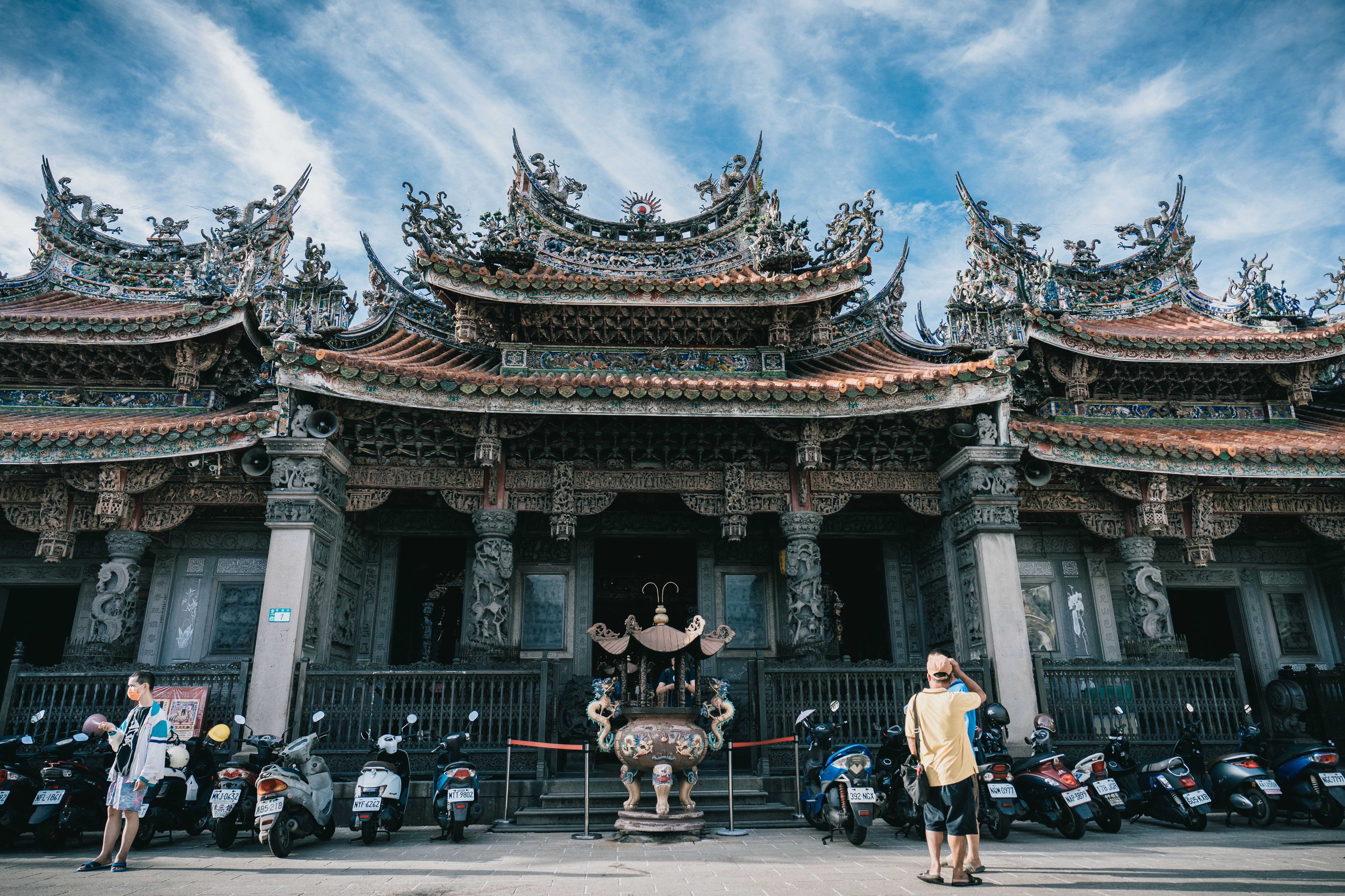 Ornate Traditional Temple with Visitors · Free Stock Photo