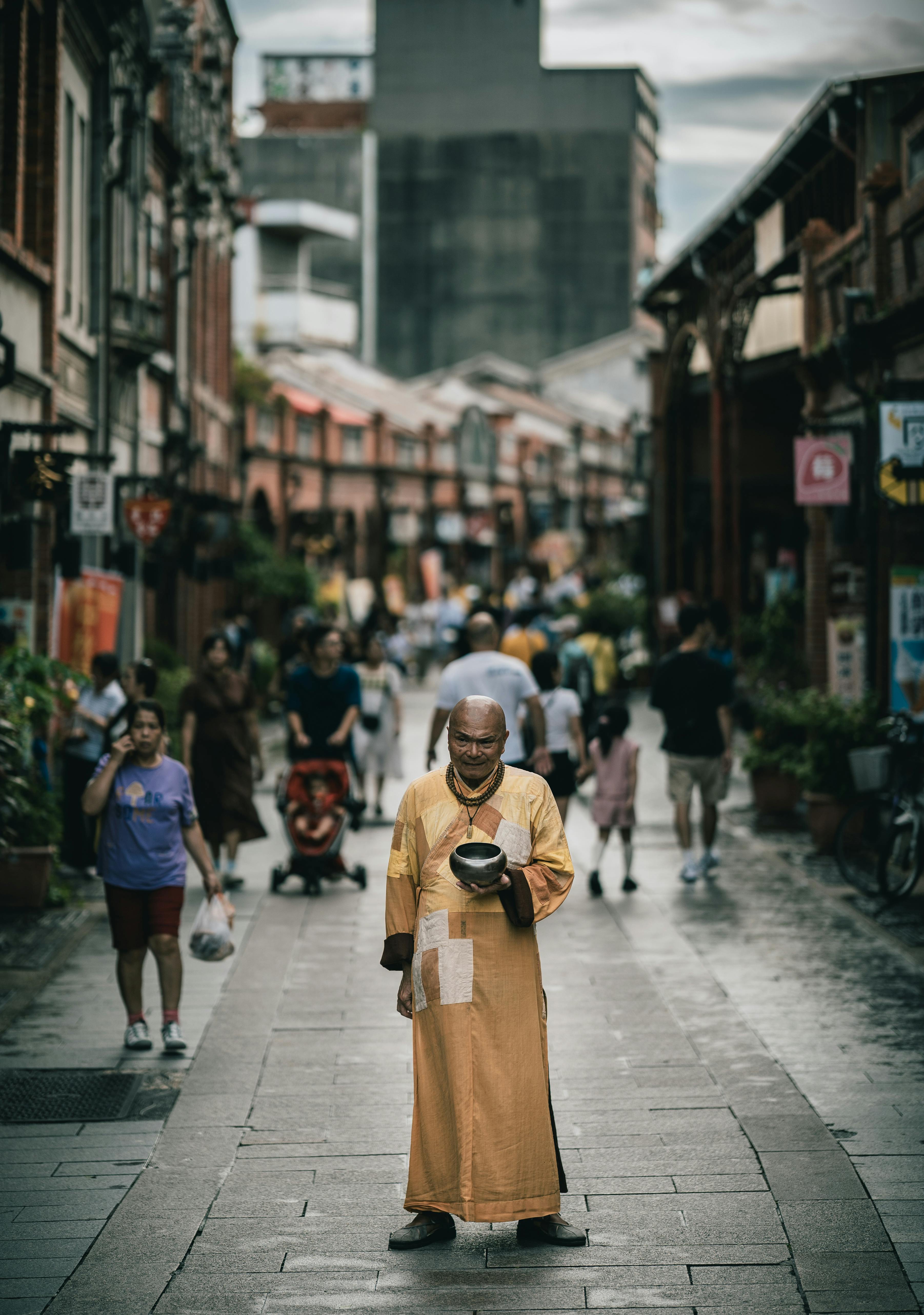 Monk Walking on Vibrant City Street in Asia · Free Stock Photo