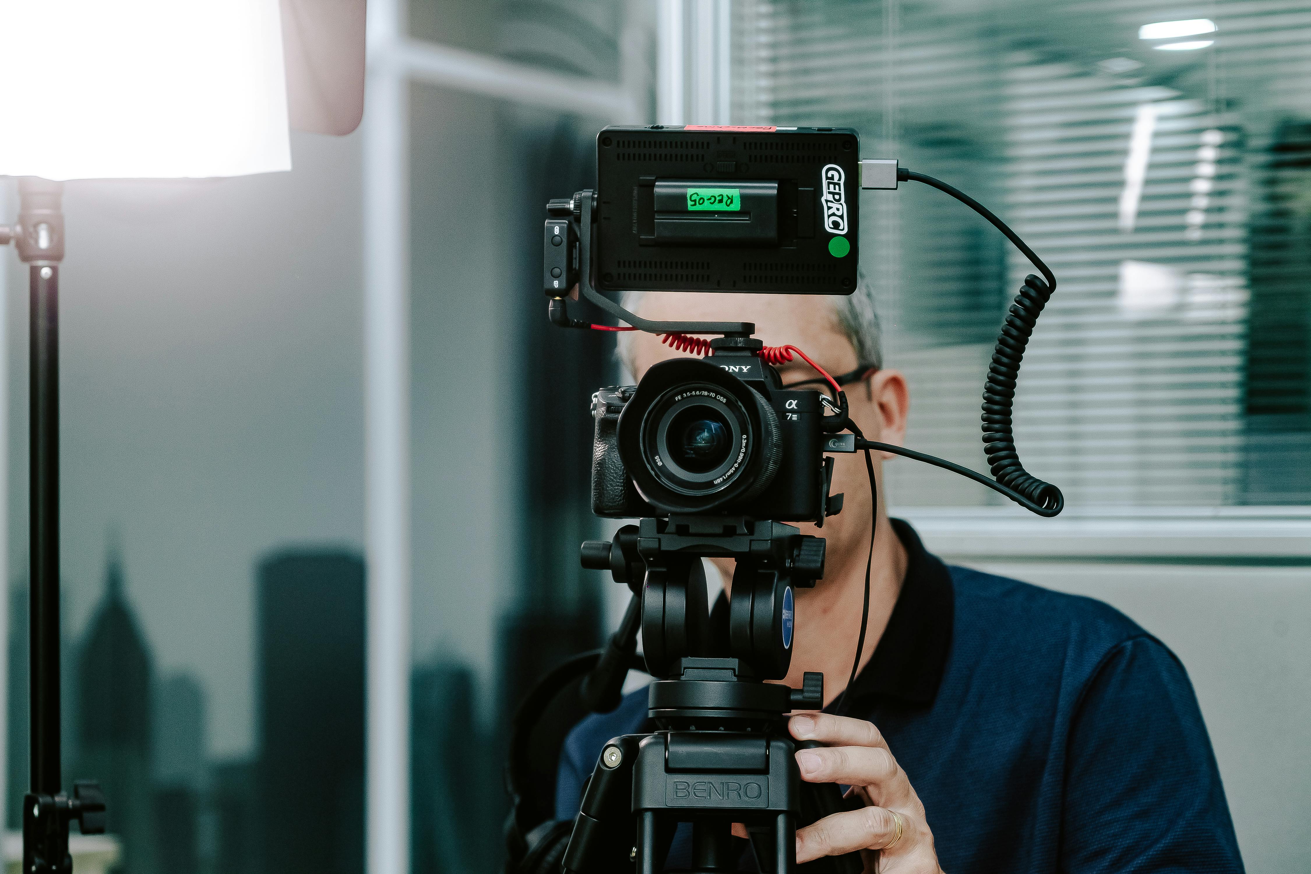Professional Videographer in Studio Setting · Free Stock Photo
