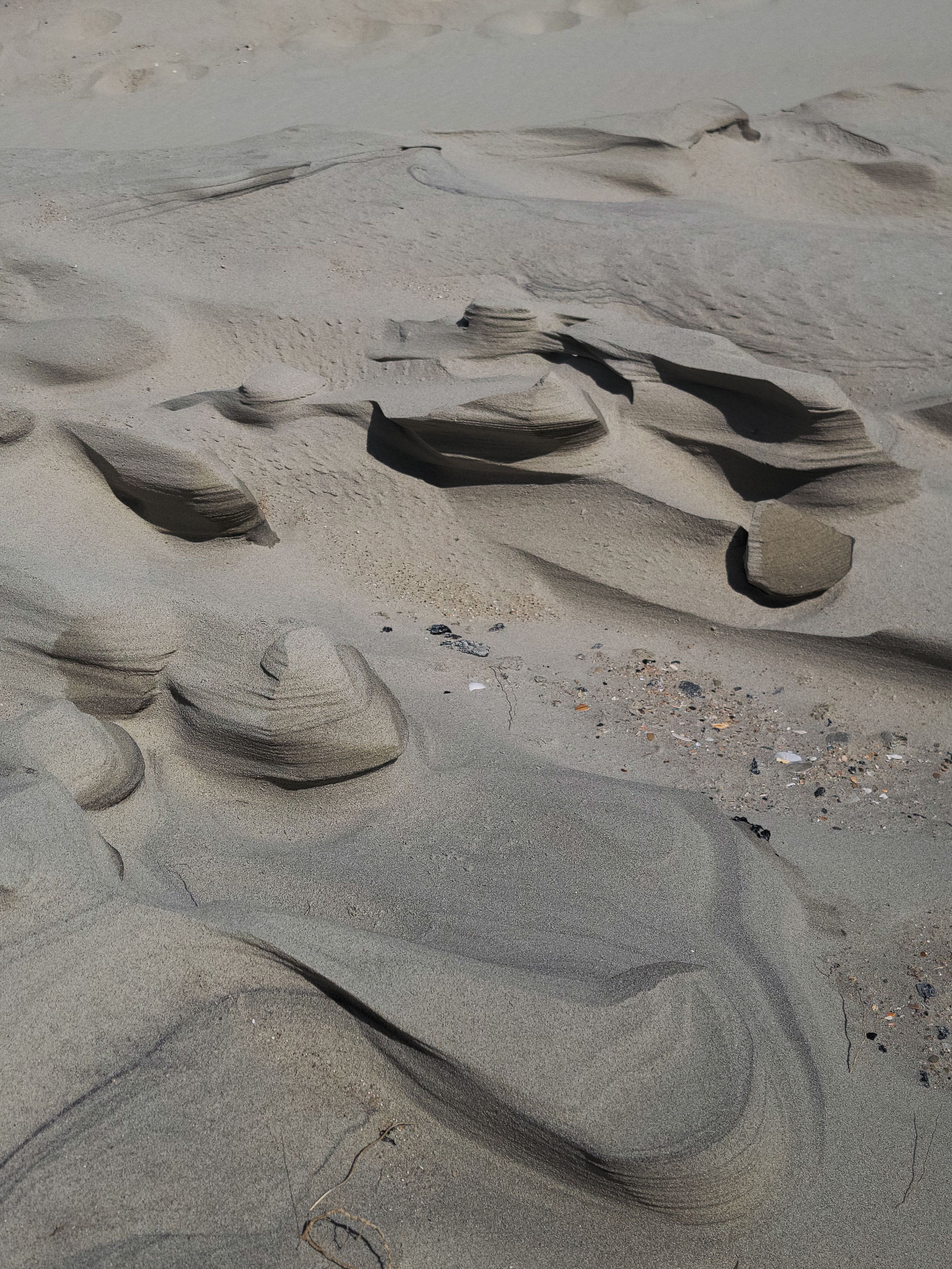 Sculpted Sand Patterns on Beach Shoreline · Free Stock Photo
