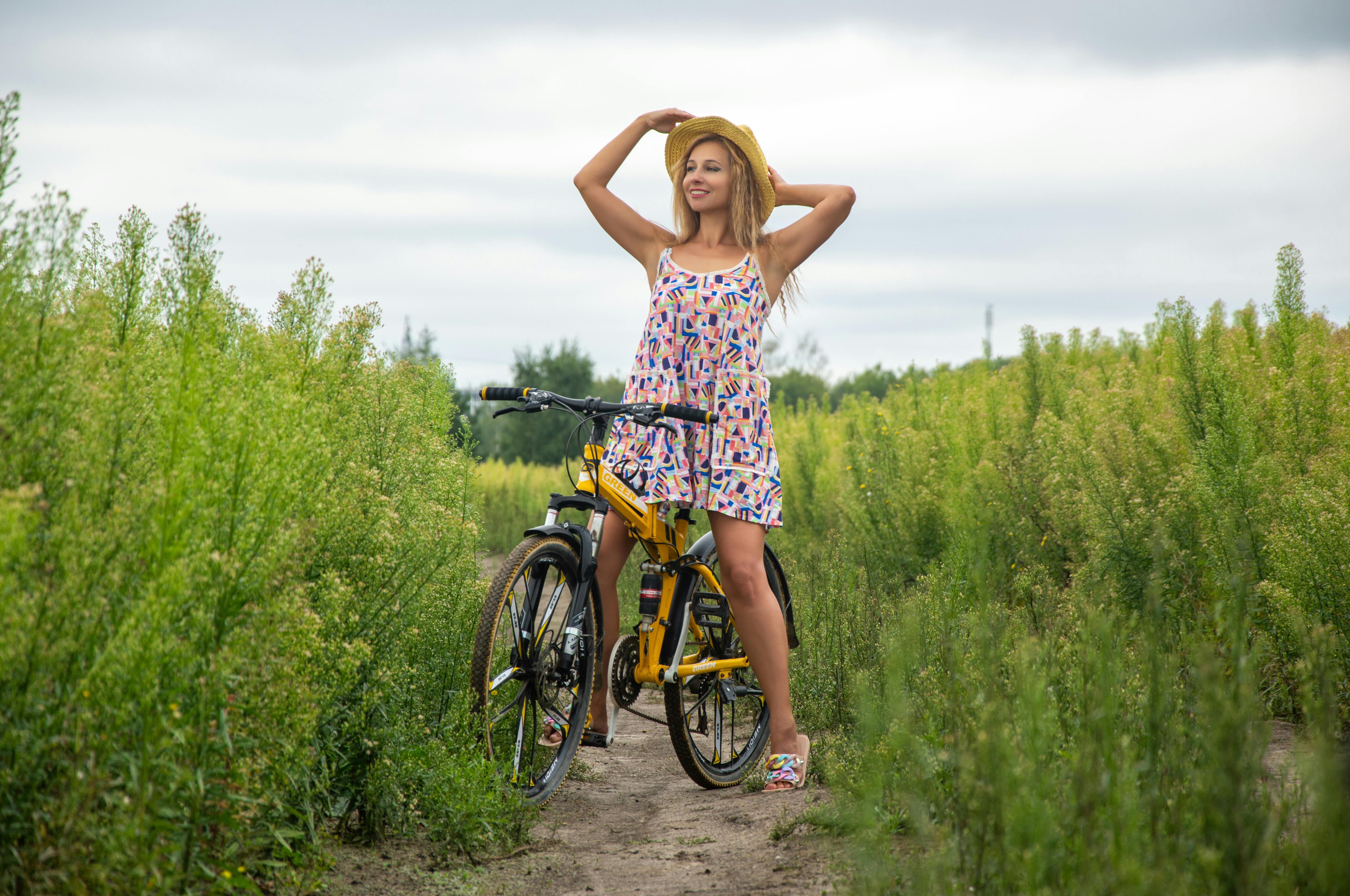 Woman Enjoying Summer Bike Ride in Nature · Free Stock Photo