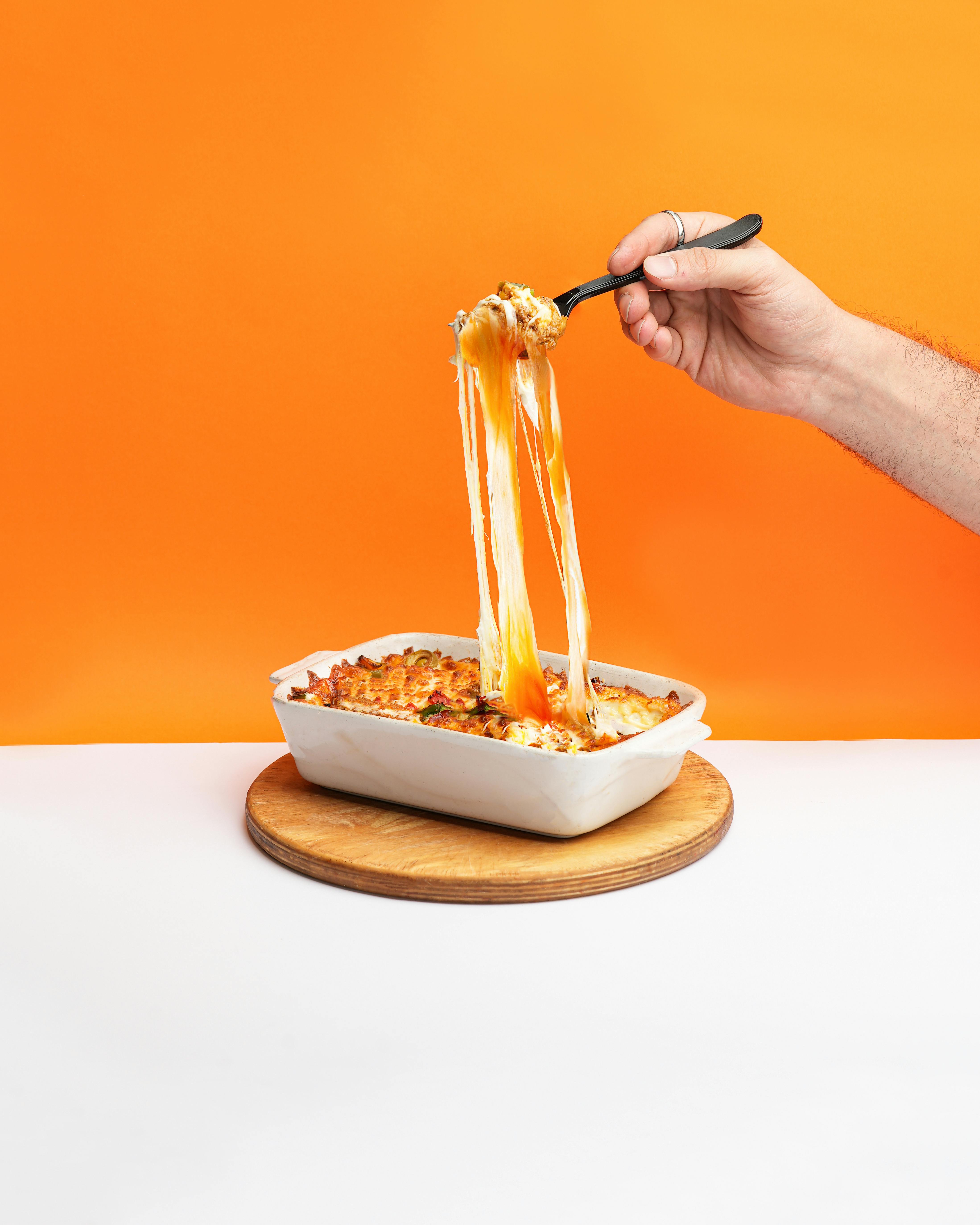 Delicious Cheese Lasagna with Melting Cheese Pull · Free Stock Photo